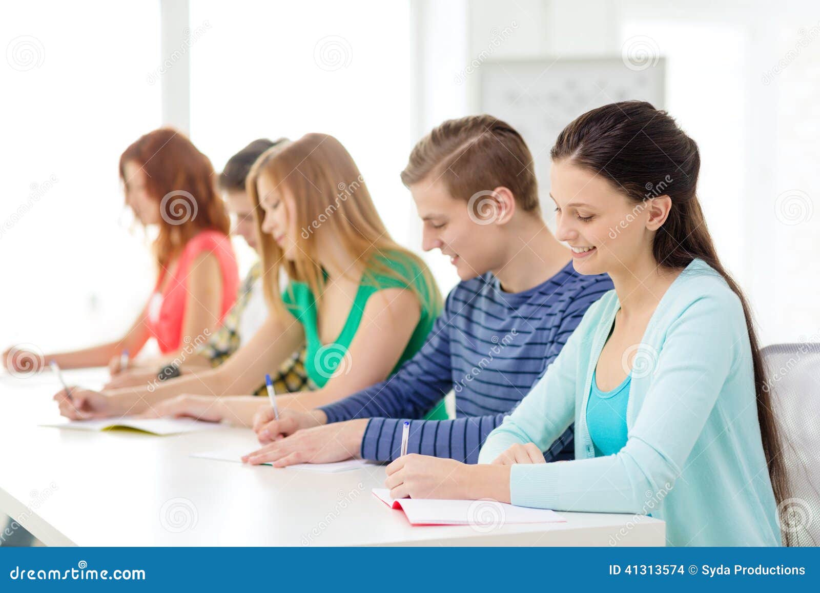 Smiling Students with Textbooks at School Stock Photo - Image of exam ...