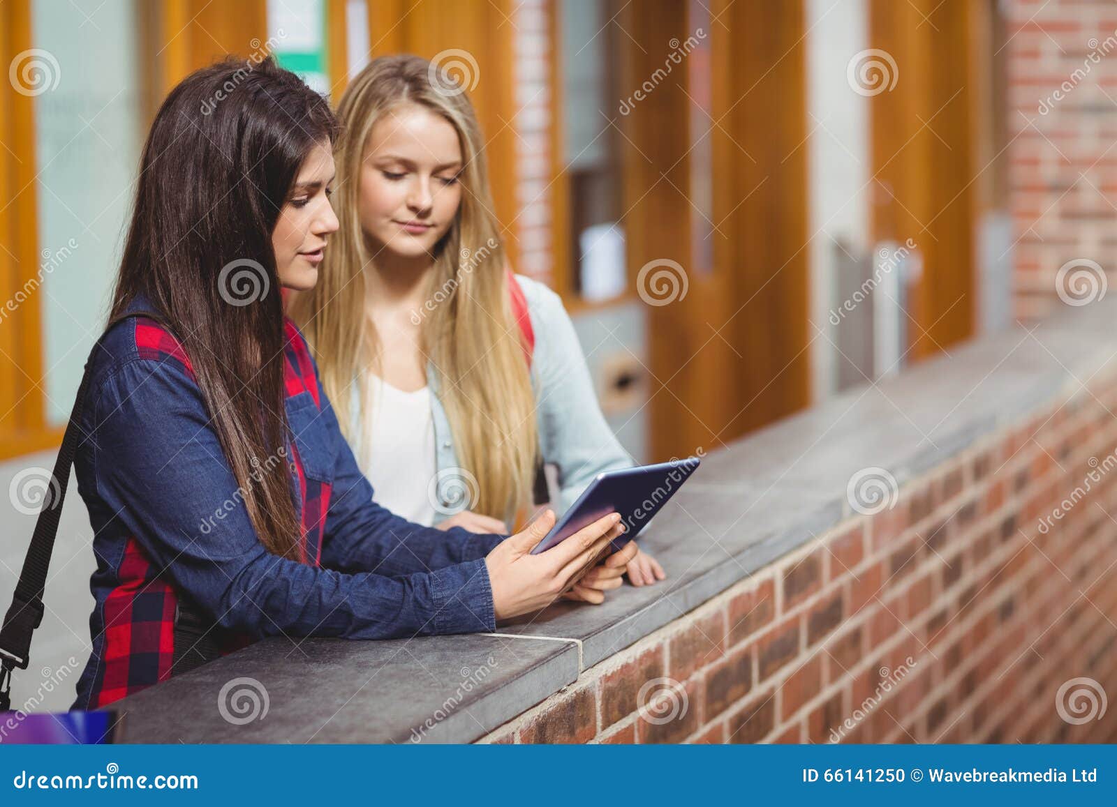 Smiling Students Using Tablet Together Stock Photo - Image of ...