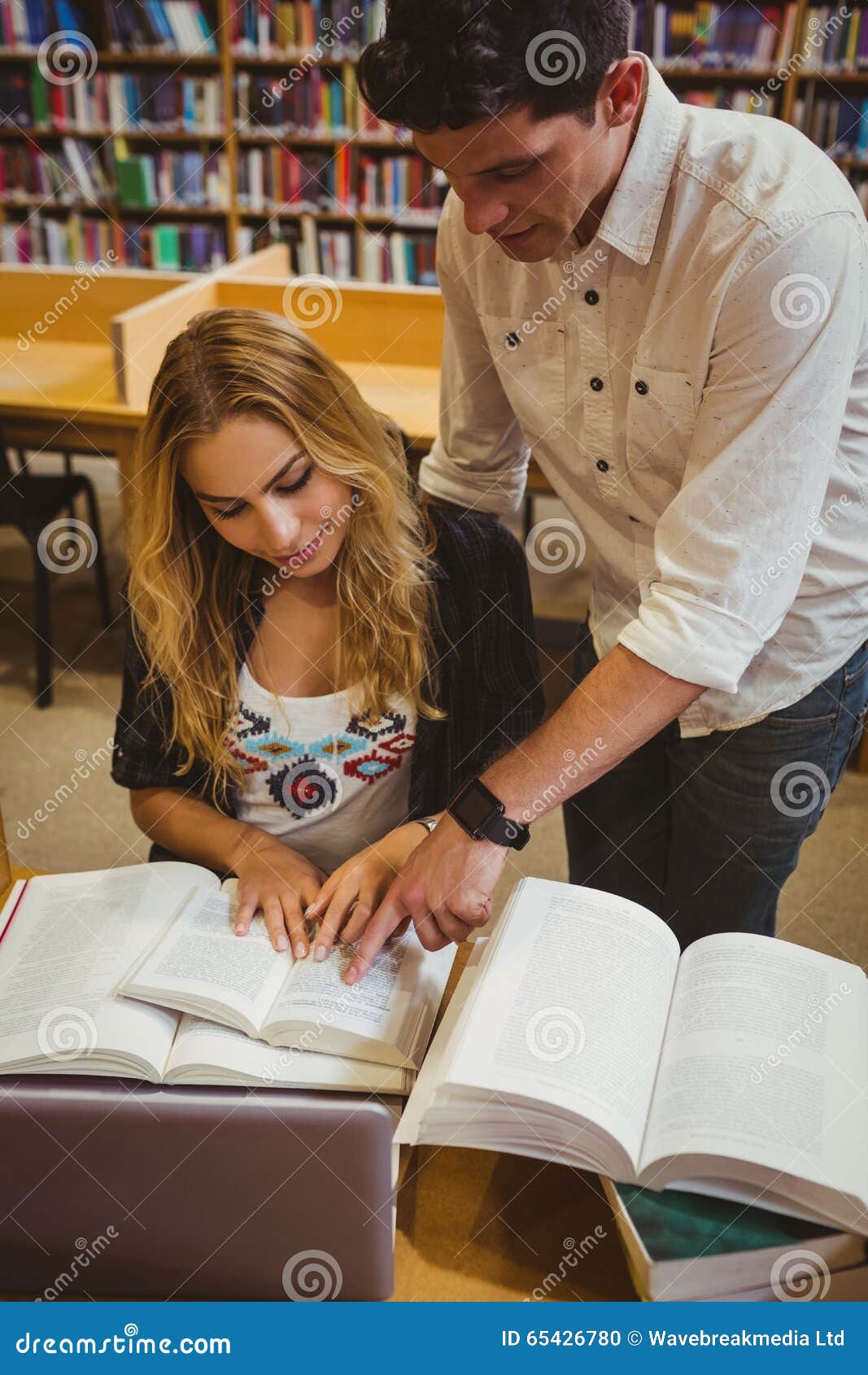 Smiling Students Working Together while Sitting at Table Stock Photo ...