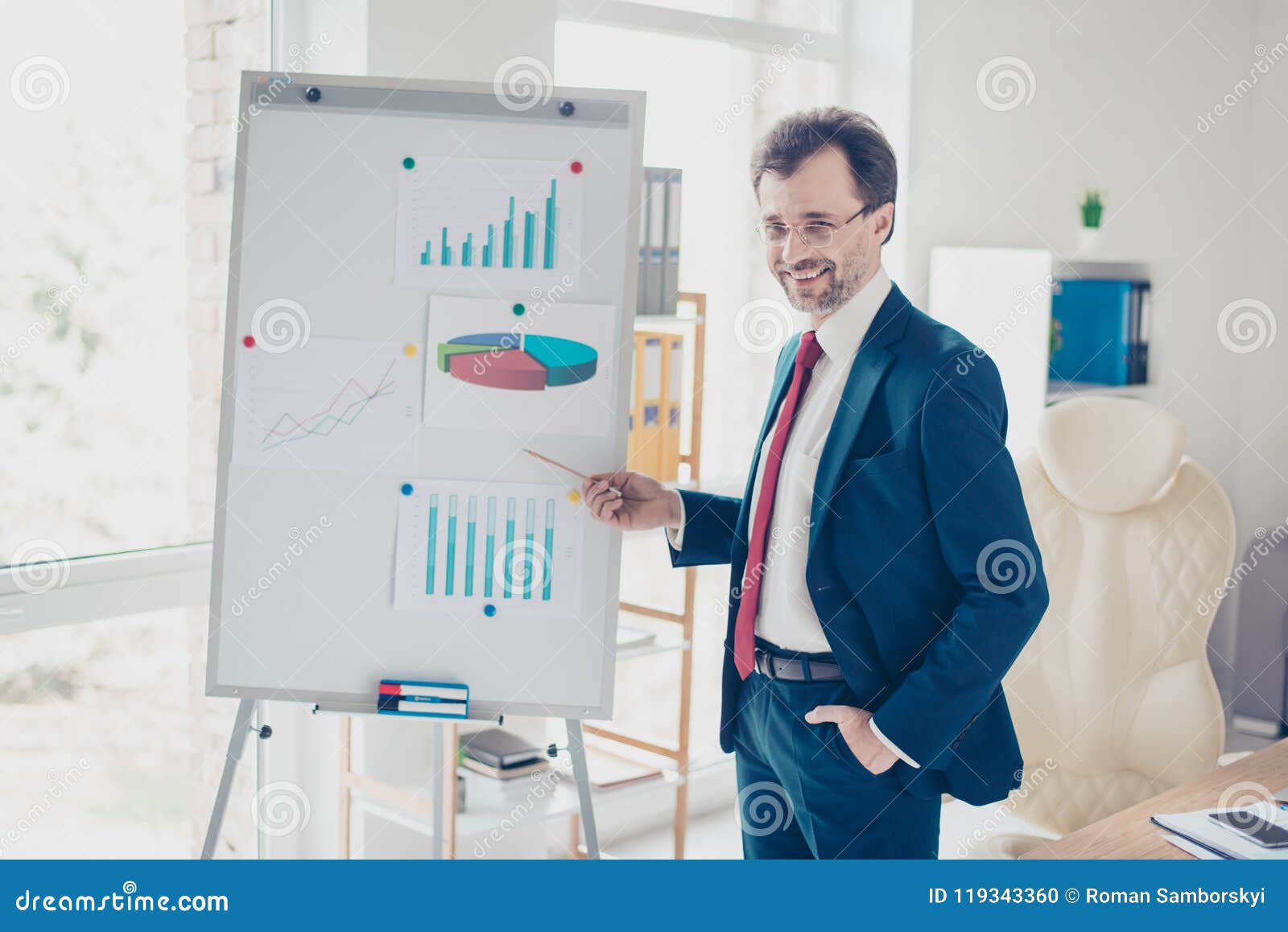 Smiling Successful Businessman is Reporting with the Flip Chart Stock ... Smiling Successful Businessman is Reporting with the Flip Chart Stock ...