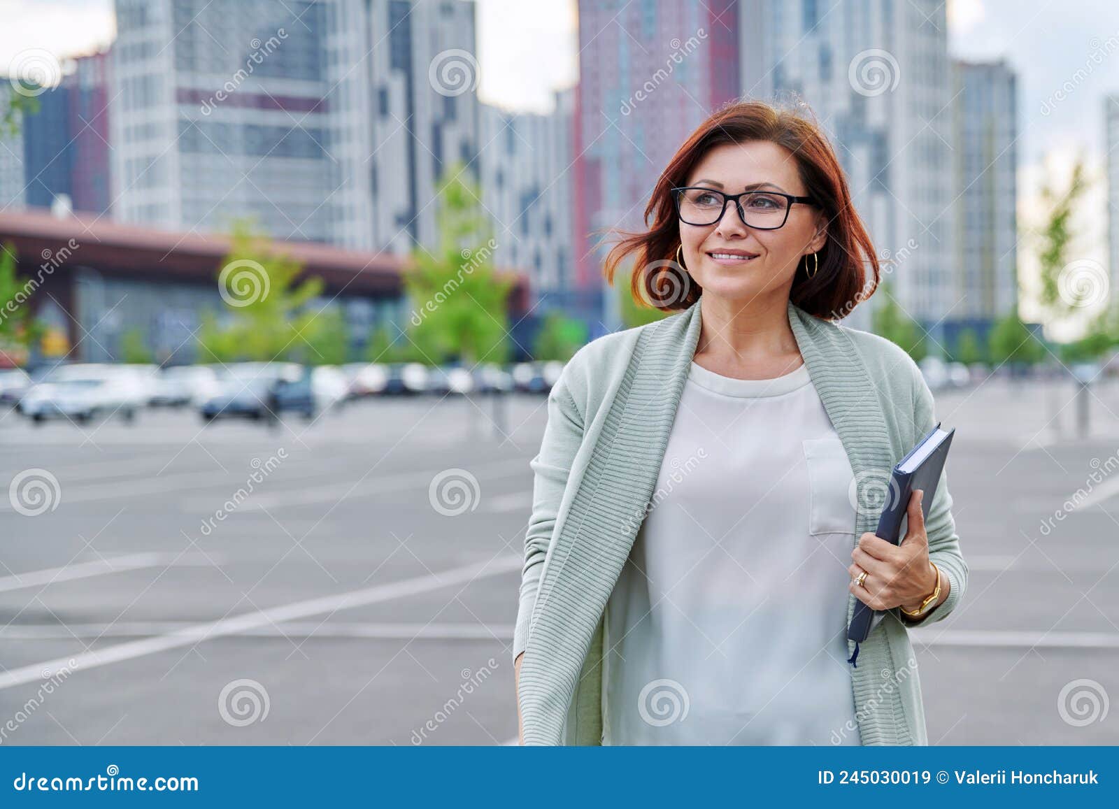 Smiling Successful Mature Business Woman Walking Outdoor, Modern Urban ... Smiling Successful Mature Business Woman Walking Outdoor, Modern Urban ...