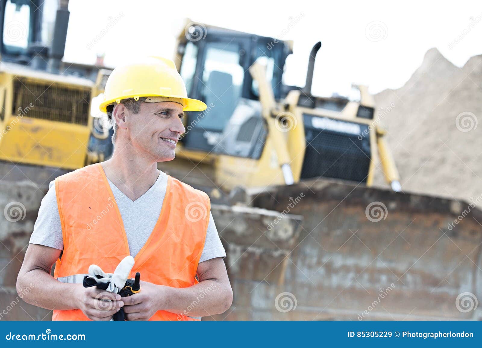 Smiling Supervisor Looking Away at Construction Site Stock Image ...