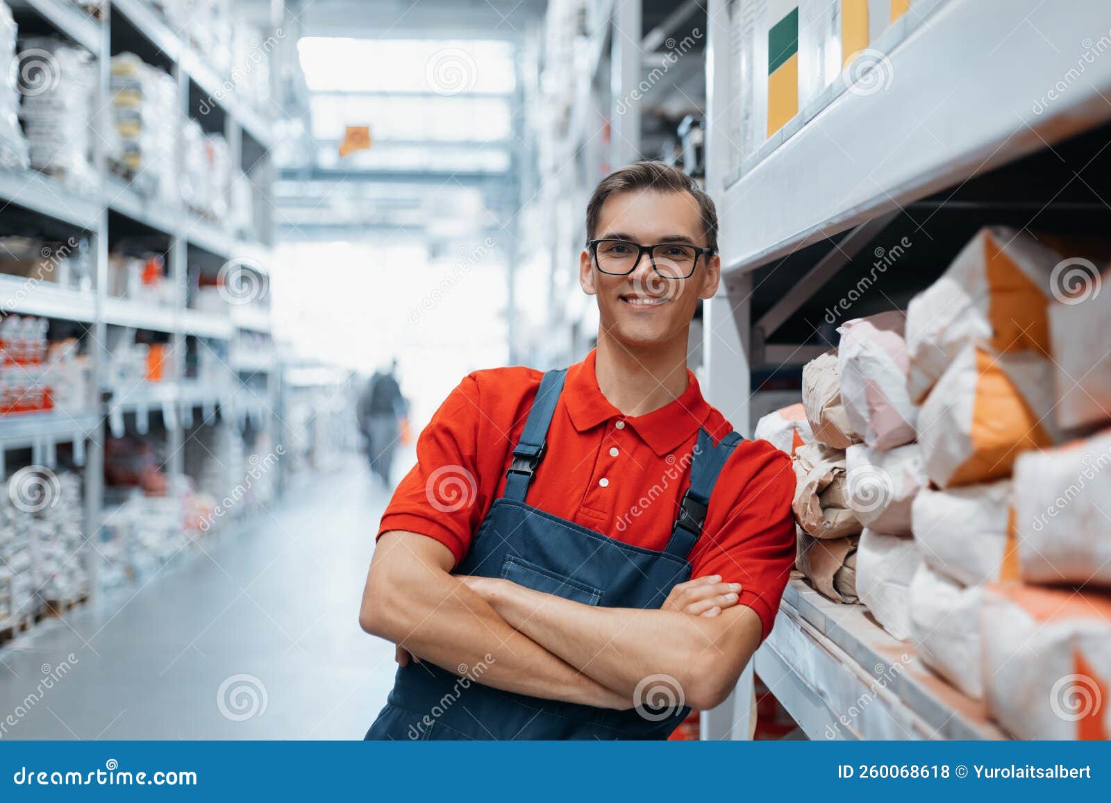 Smiling Supervisor Standing Next To a Rack of Plaster. Stock Photo ...