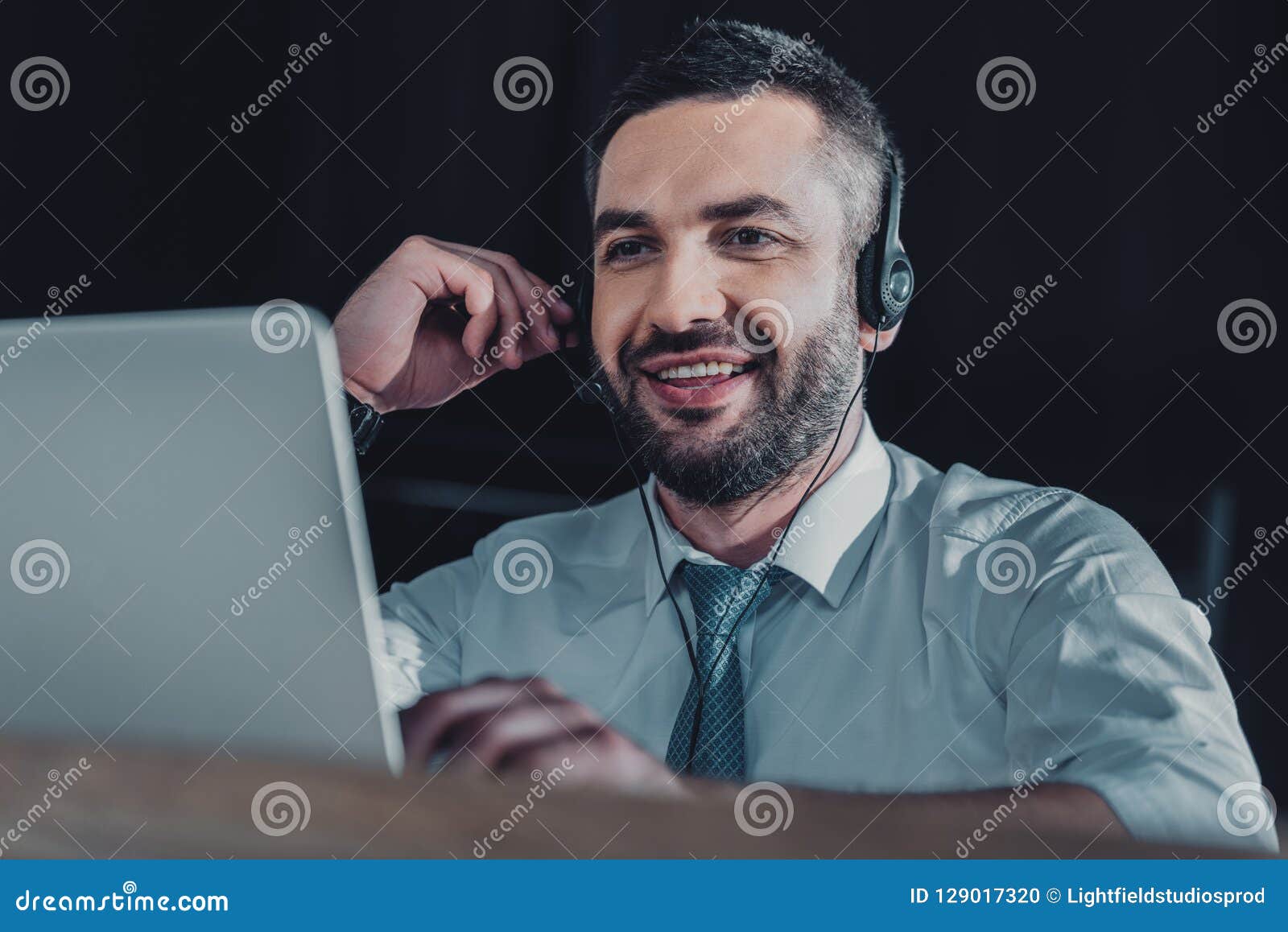Smiling Support Hotline Worker with Laptop and Microphone Stock Photo ...