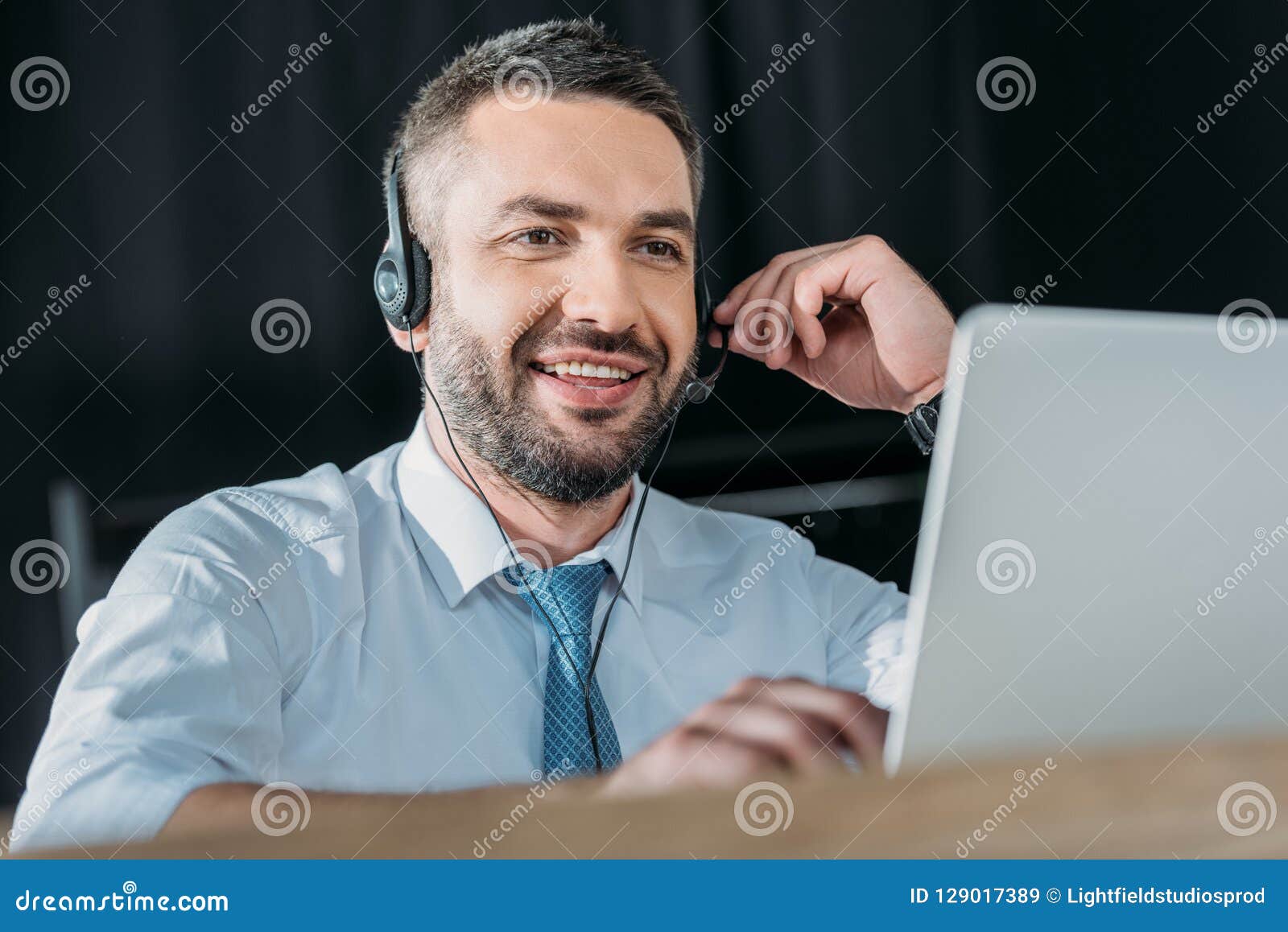 Smiling Support Hotline Worker with Laptop and Microphone Stock Image ...