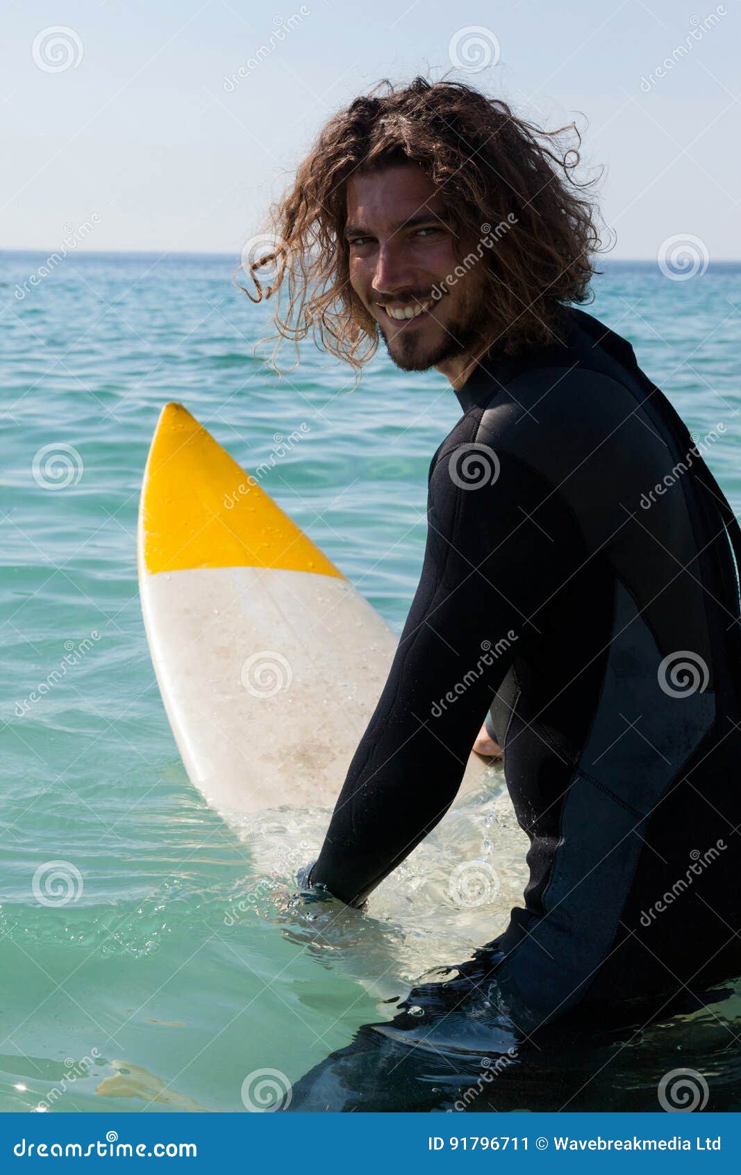 Smiling Surfer Sitting on Surfboard at Seacoast Stock Image - Image of ...