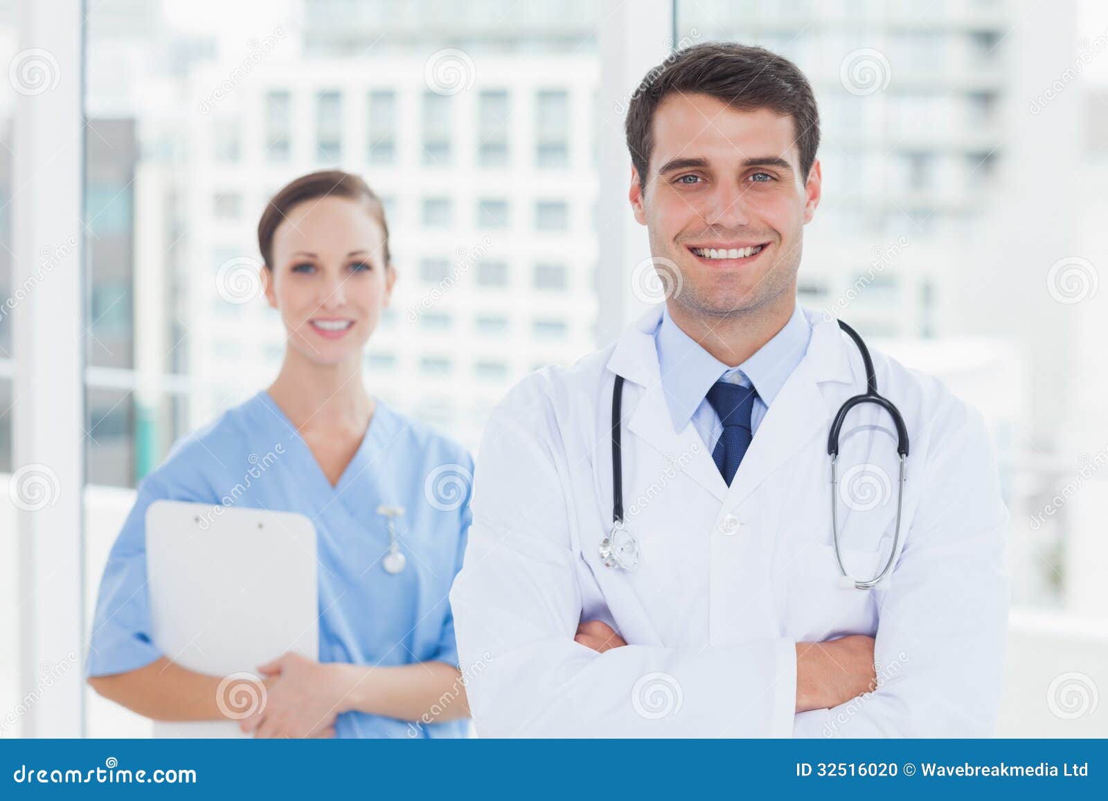 Smiling Surgeon and Doctor Posing Together Stock Photo - Image of ...