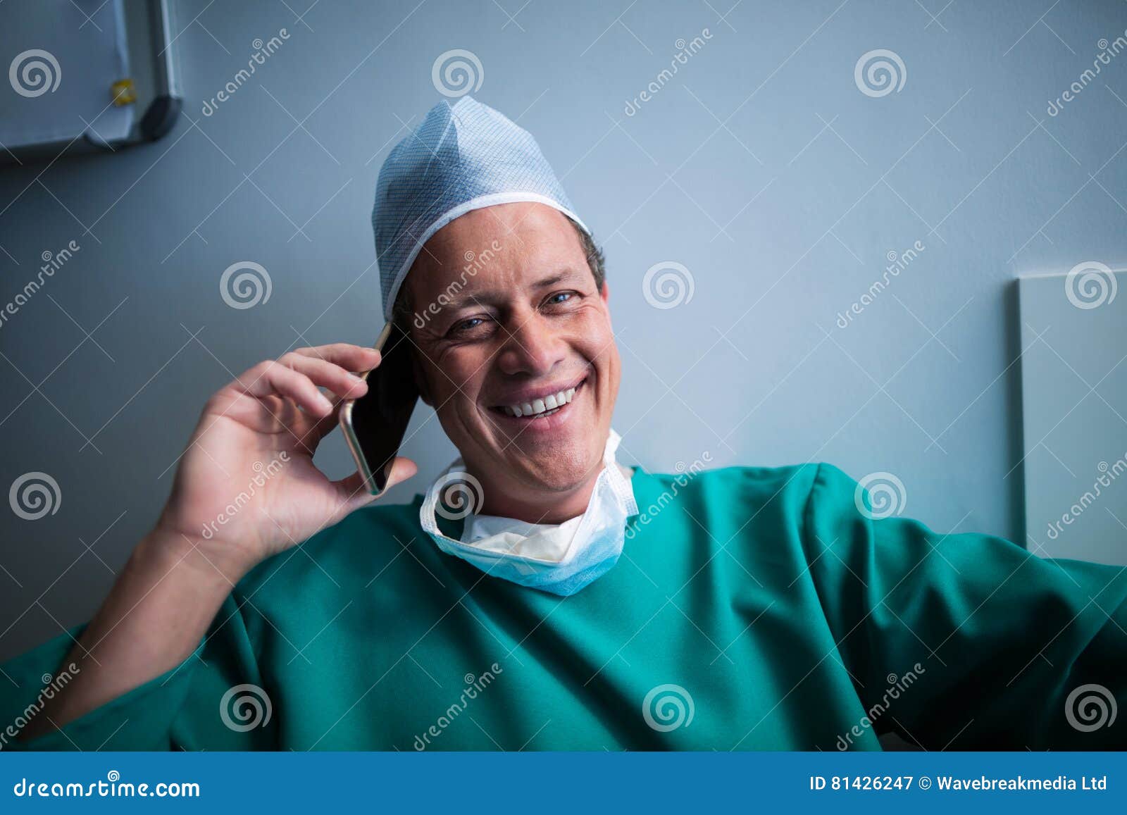 Smiling Surgeon Talking on Mobile Phone Stock Image - Image of ...