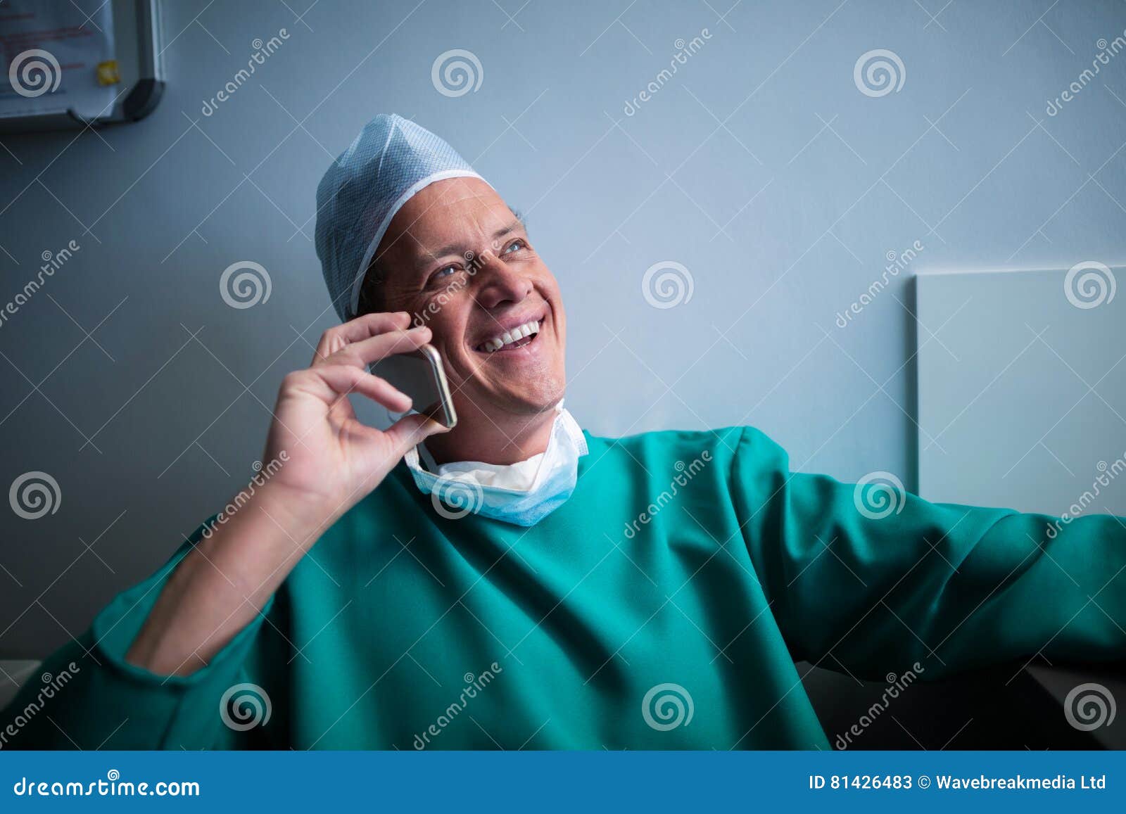 Smiling Surgeon Talking on Mobile Phone Stock Image - Image of adult ...