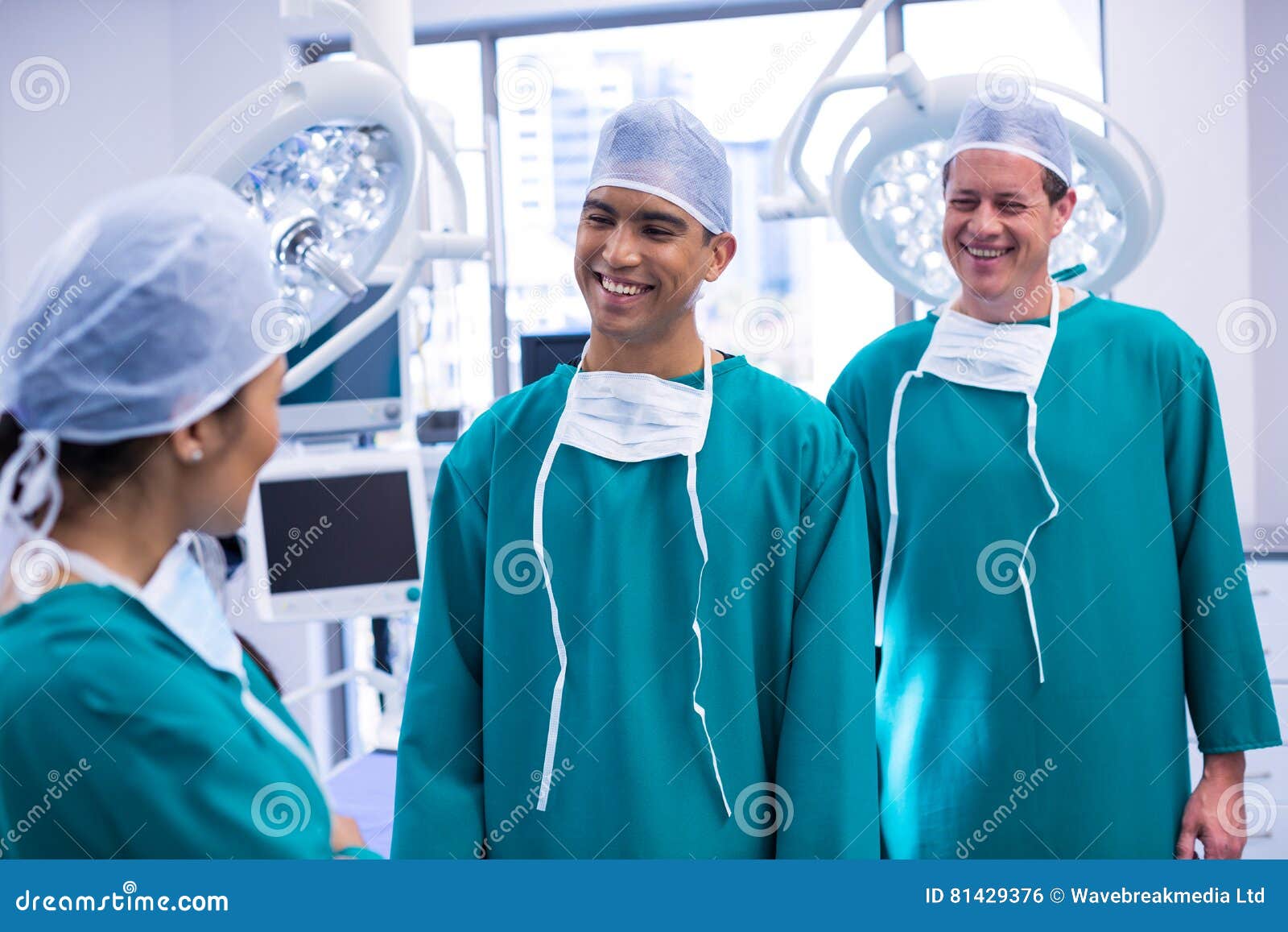 Smiling Surgeons Interacting with Each Other in Operation Room Stock ...