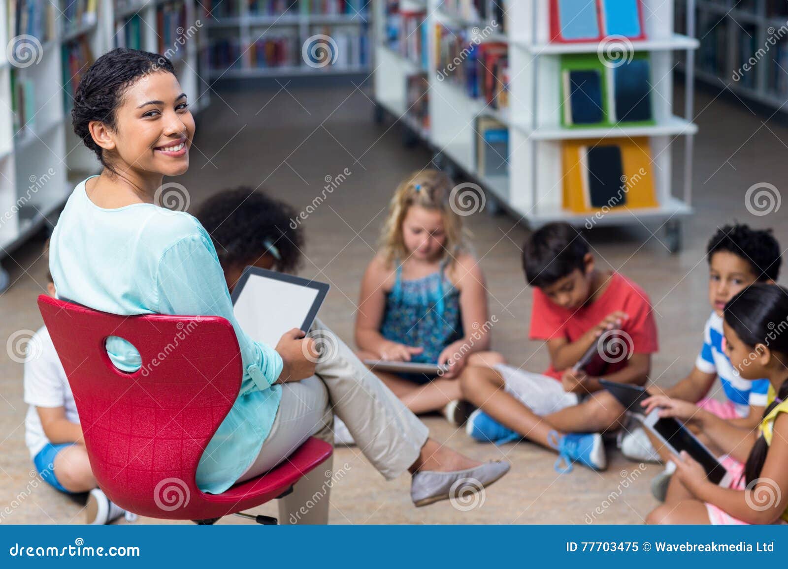 Smiling Teacher with Children Using Digital Tablets Stock Image - Image ...