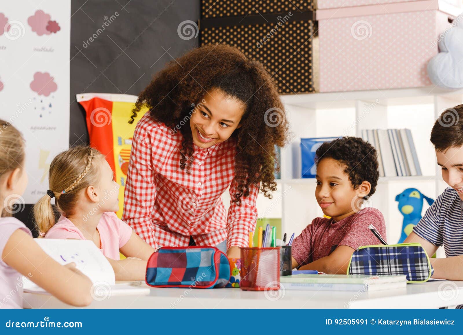 Smiling Teacher Explaining Lesson Stock Image - Image of beautiful ...