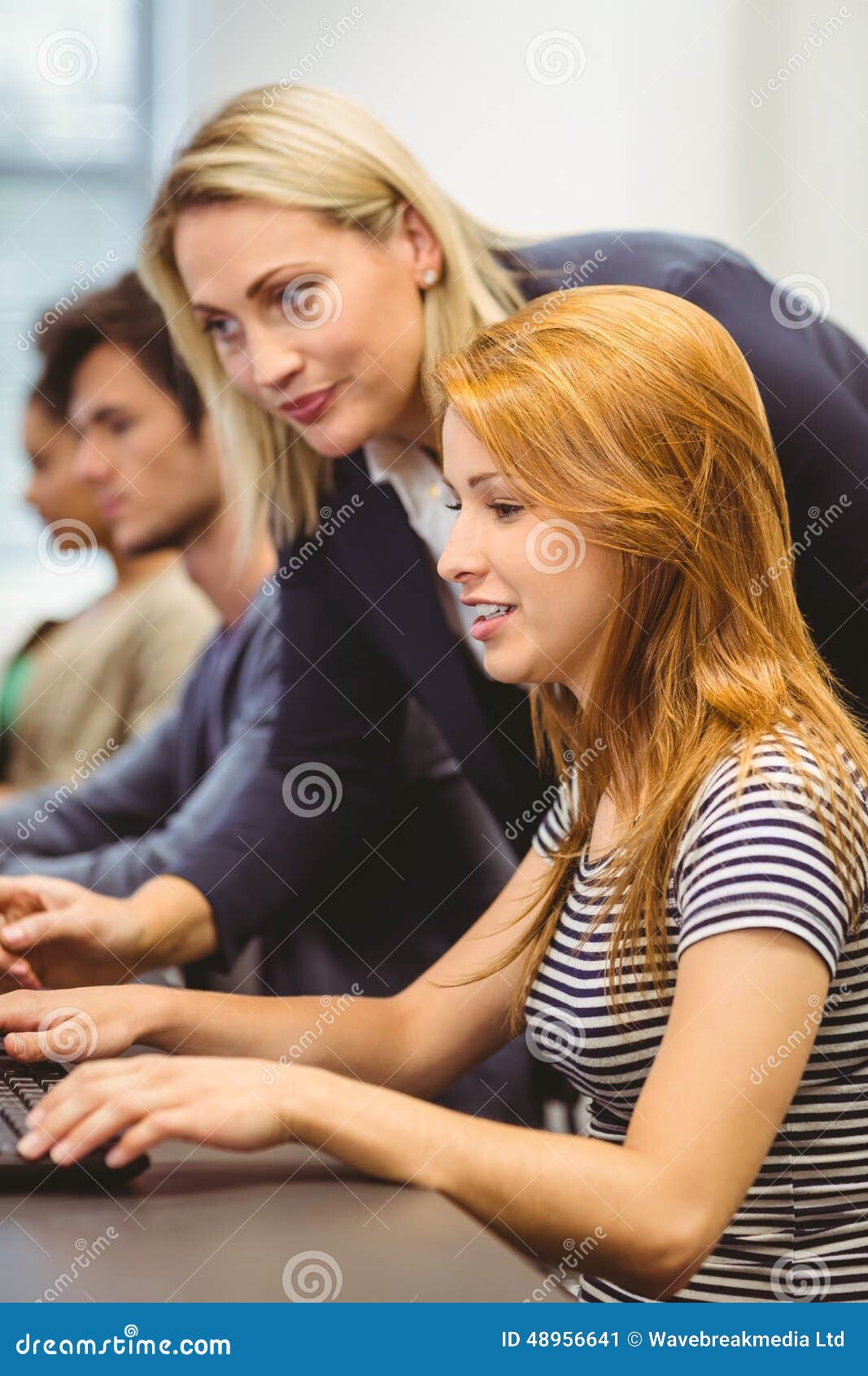 Smiling Teacher Explaining Something To Student Stock Image - Image of ...