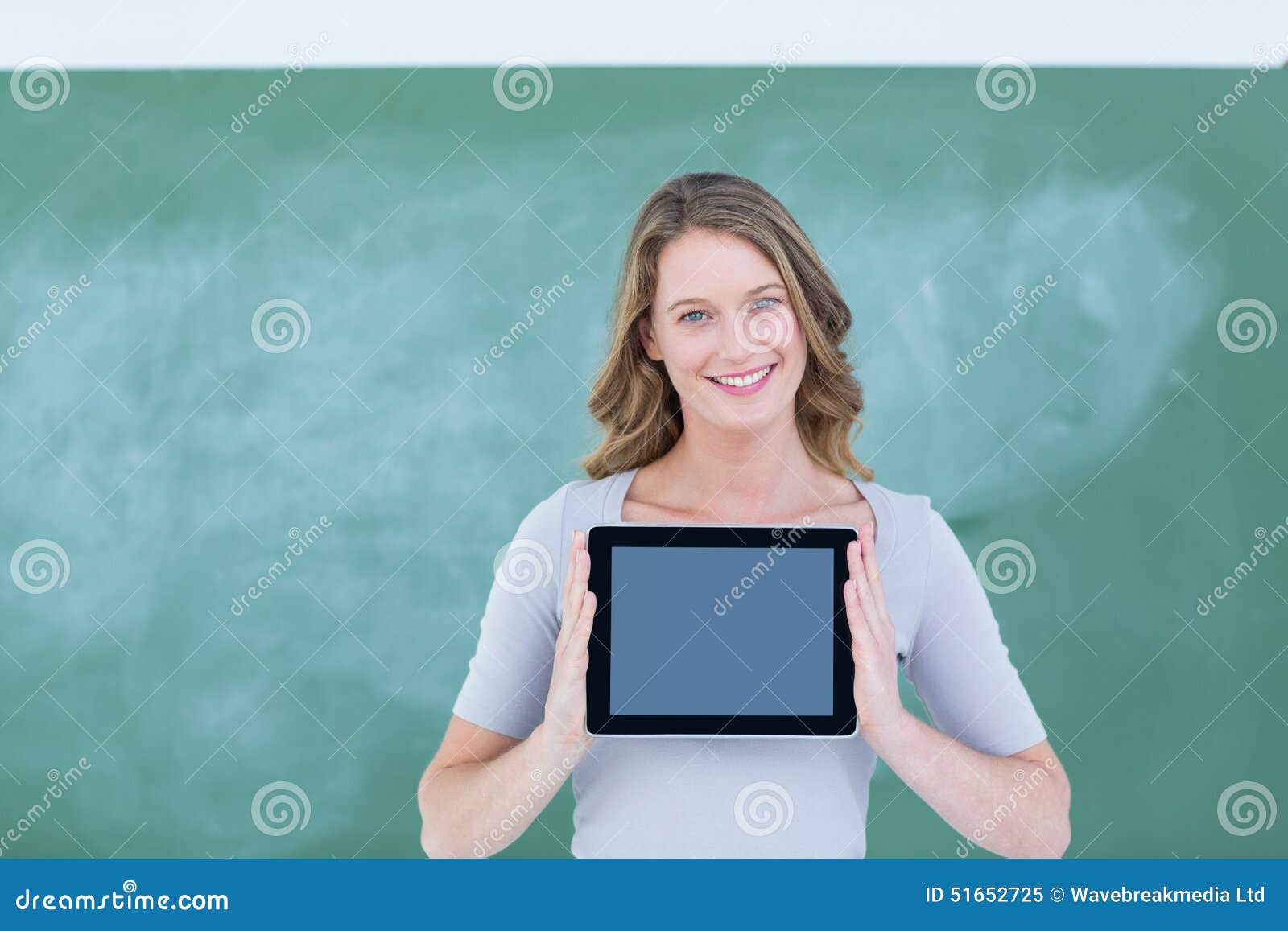 Smiling Teacher Holding Tablet Pc Stock Image - Image of hair, fair ...