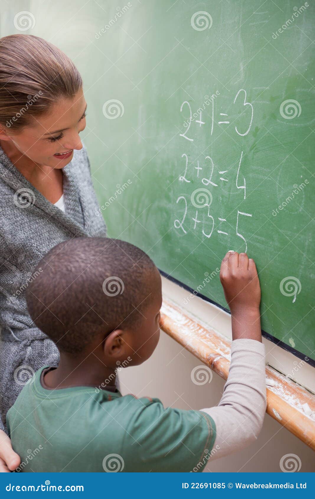 A Smiling Teacher and a Pupil Making an Addition Stock Image - Image of ...