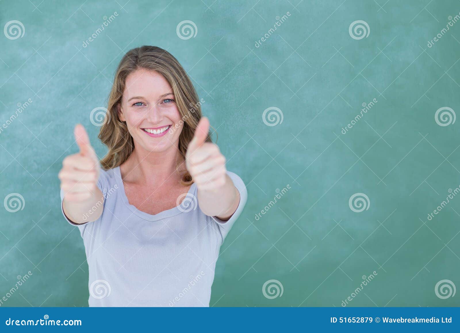 Smiling Teacher Standing Thumbs Up in Front of Blackboard Stock Image ...