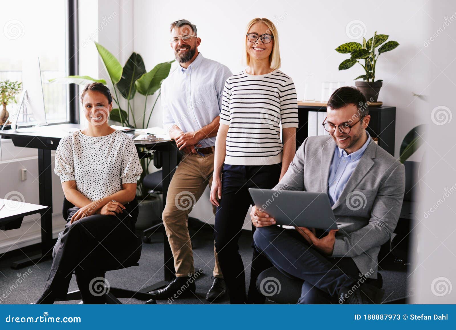 Smiling Team of Businesspeople in an Office Stock Image - Image of ...