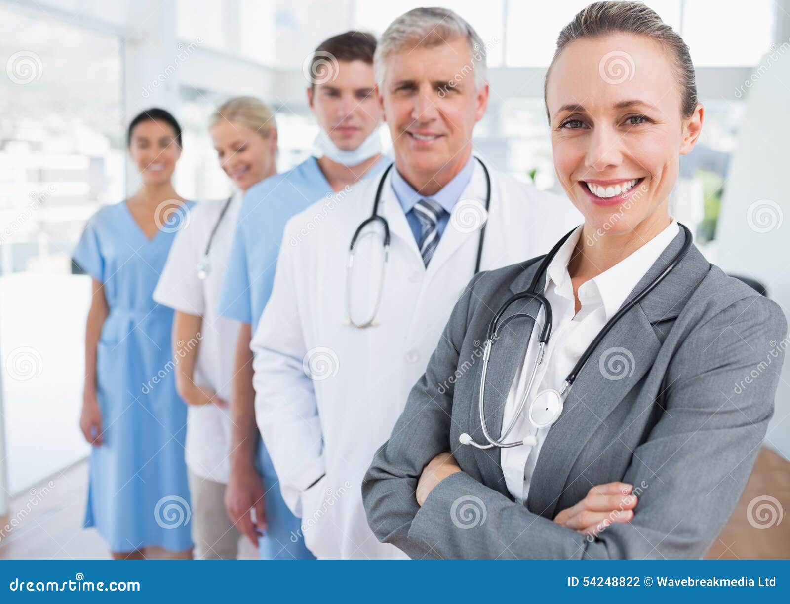Smiling Team of Doctors Standing in Line Stock Photo - Image of ...