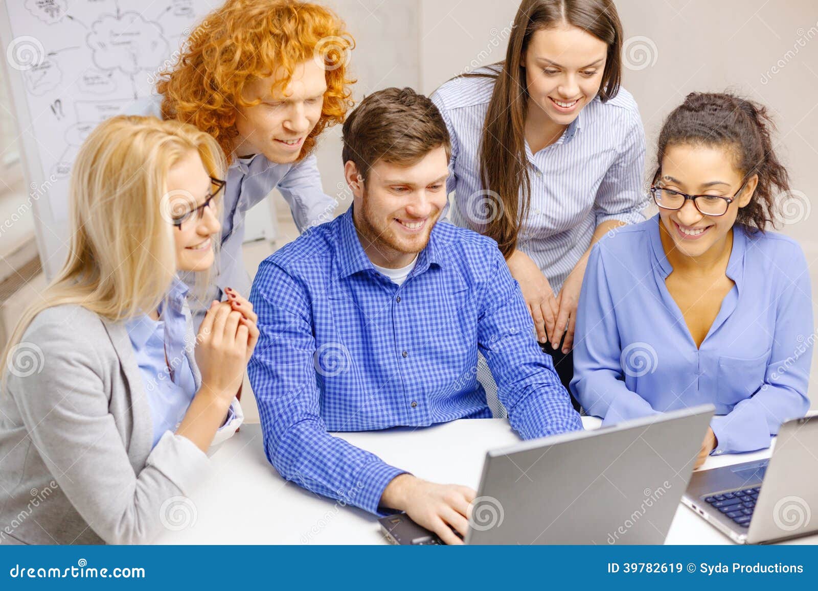 Smiling Team with Laptop Computers in Office Stock Image - Image of ...