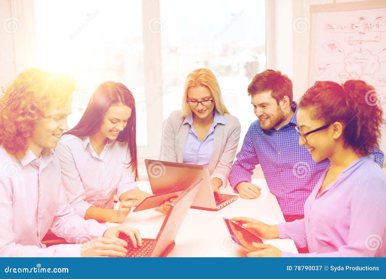 Smiling Team with Laptop and Table Pc Computers Stock Image - Image of ...