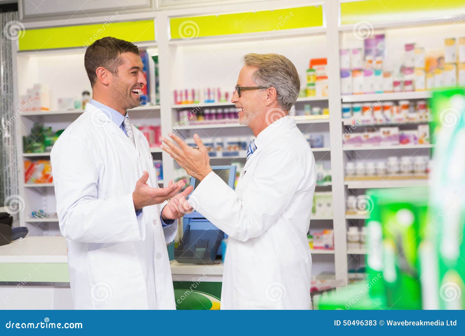 Smiling Team of Pharmacist Speaking Together Stock Image - Image of ...