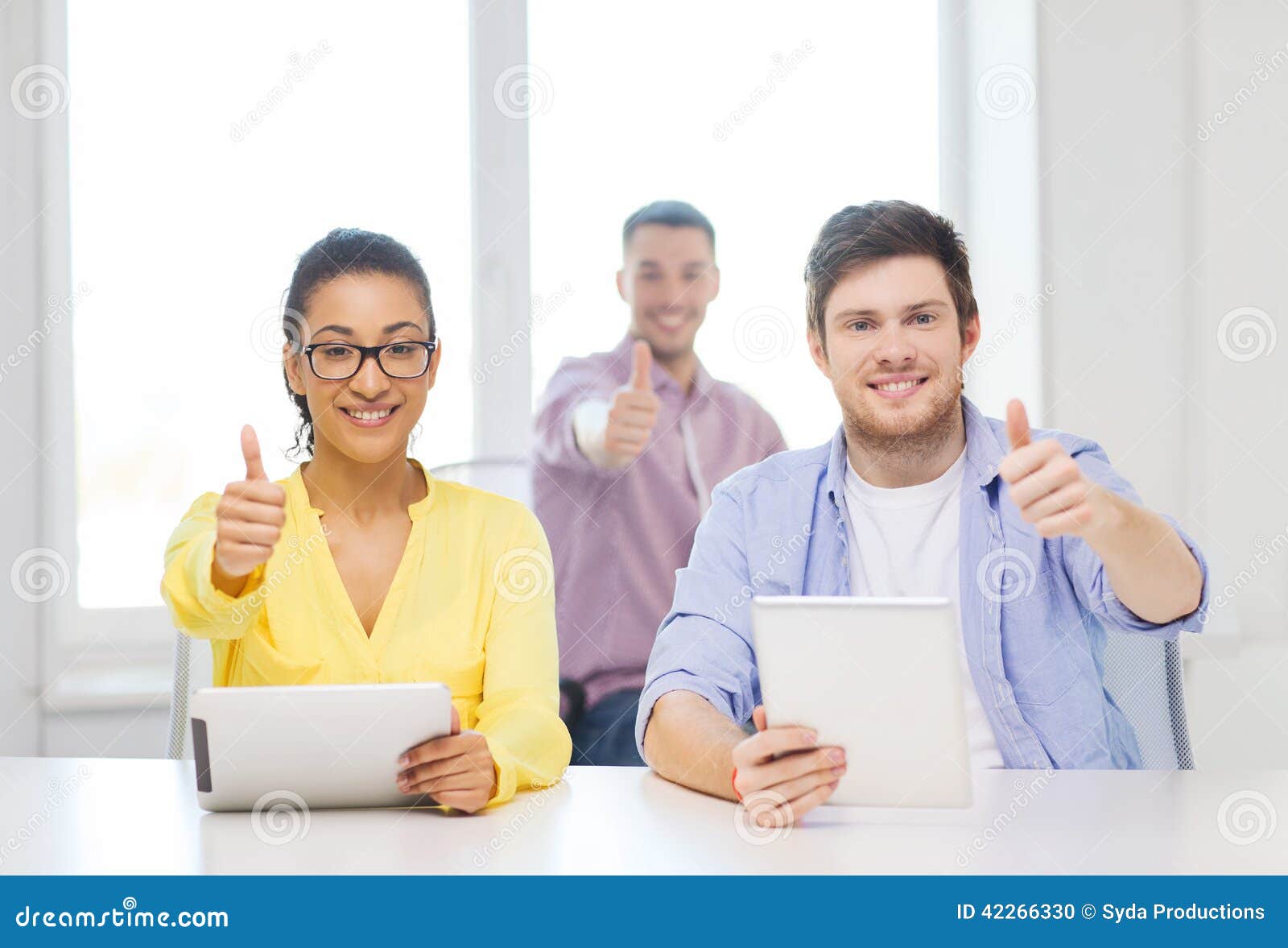 Smiling Team with Tablet Pc Computers at Office Stock Photo - Image of ...