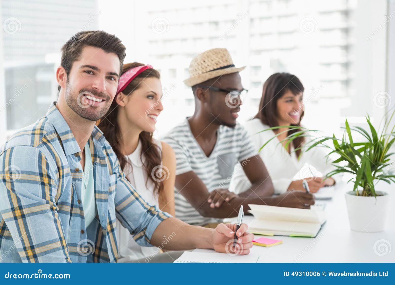 Smiling Teamwork Listening and Taking Notes Stock Photo - Image of ...