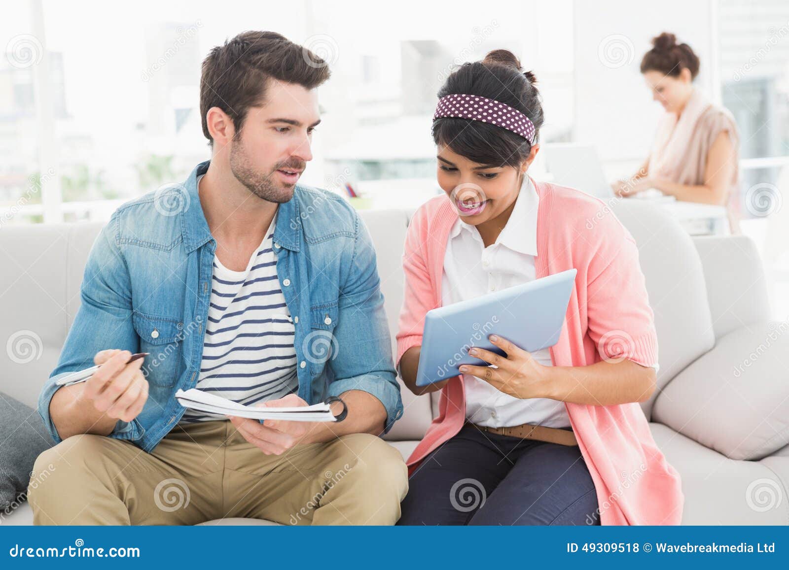 Smiling Teamwork Working Together on Couch Stock Photo - Image of ...