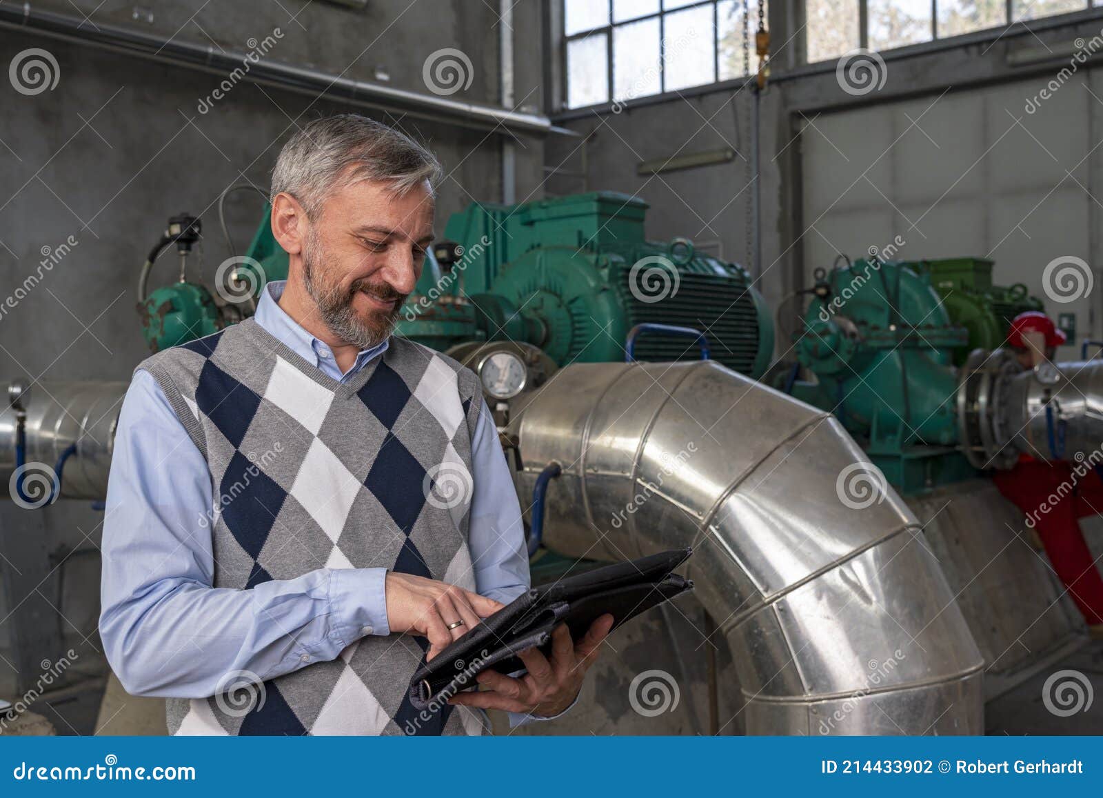 Smiling Technical Manager Using Digital Tablet in Mechanical Room Stock ...
