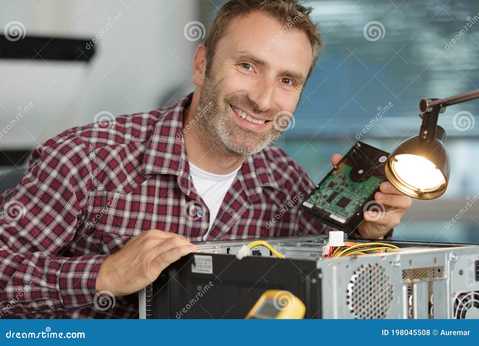 Smiling Technician Holding Computer Component Stock Photo - Image of ...