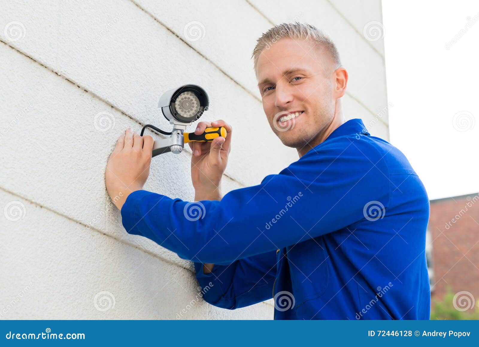 Technician Installing Indoor Air Conditioner Condenser Unit On Wall ...