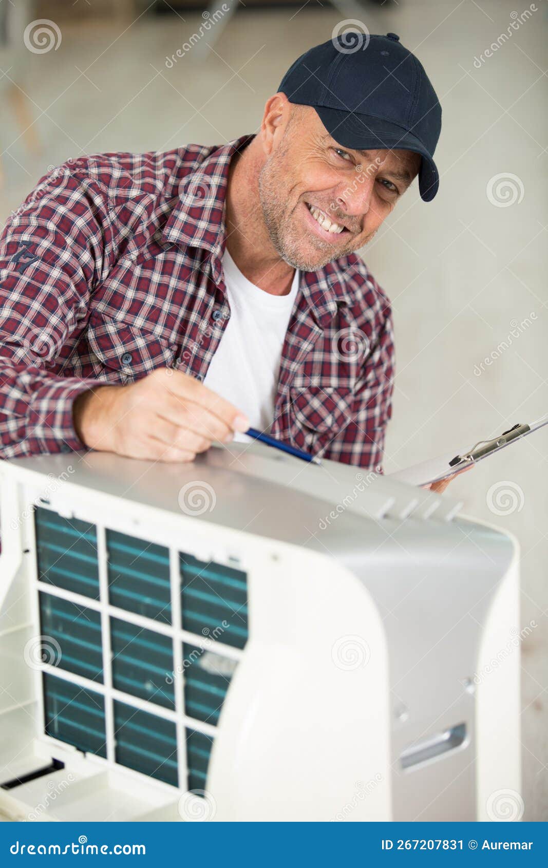Smiling Technician Repairing Electric Stove Stock Image - Image of ...