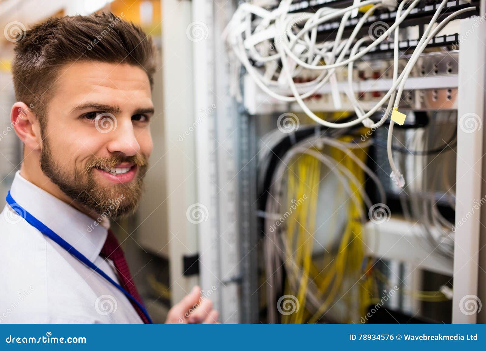 Smiling Technician Standing in a Server Room Stock Photo - Image of ...