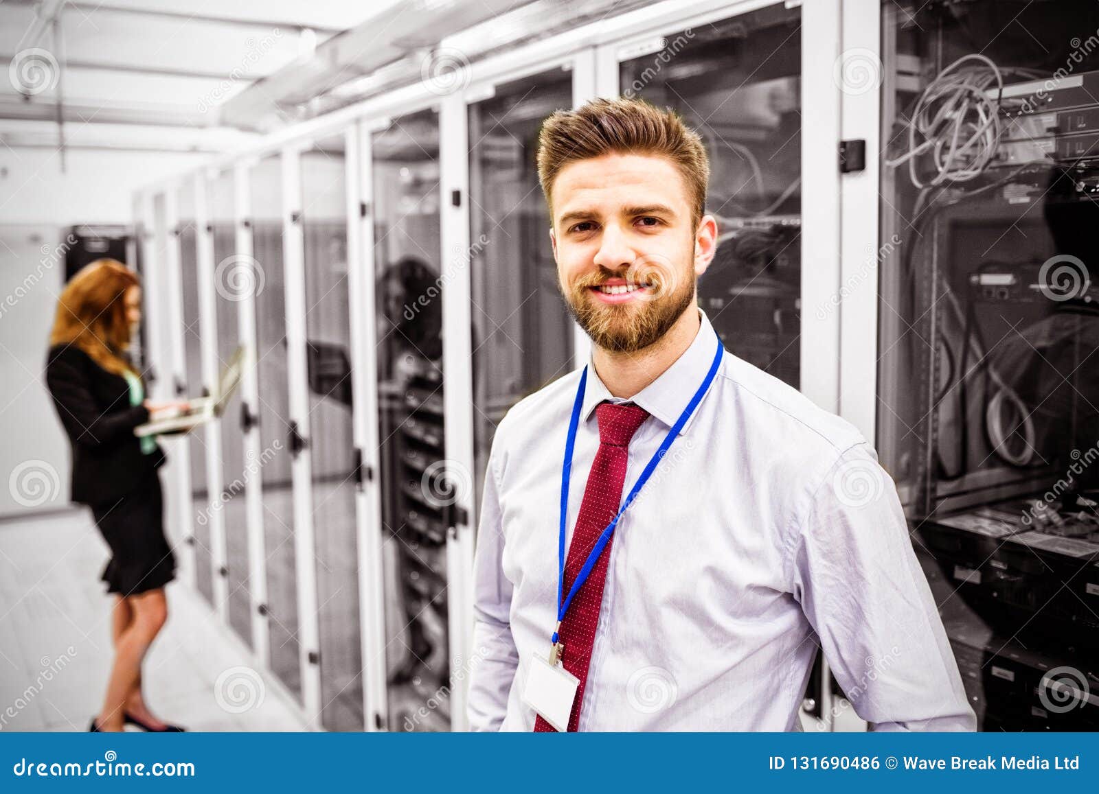 Smiling Technician Standing in a Server Room Stock Photo - Image of ...