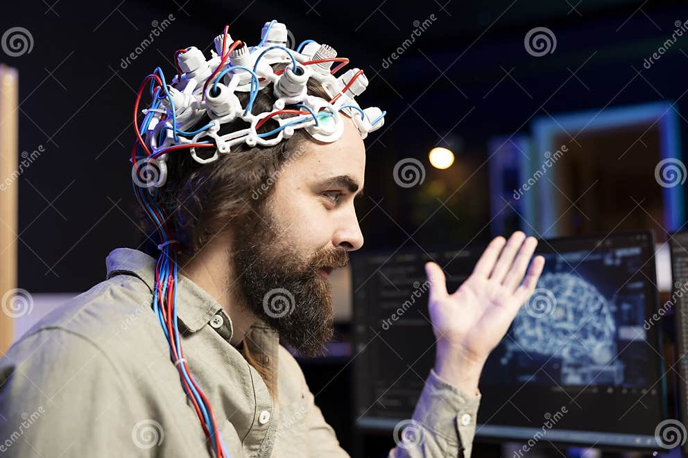 Smiling Technician Using EEG Headset To Upload Consciousness into Computer Stock Photo - Image ...