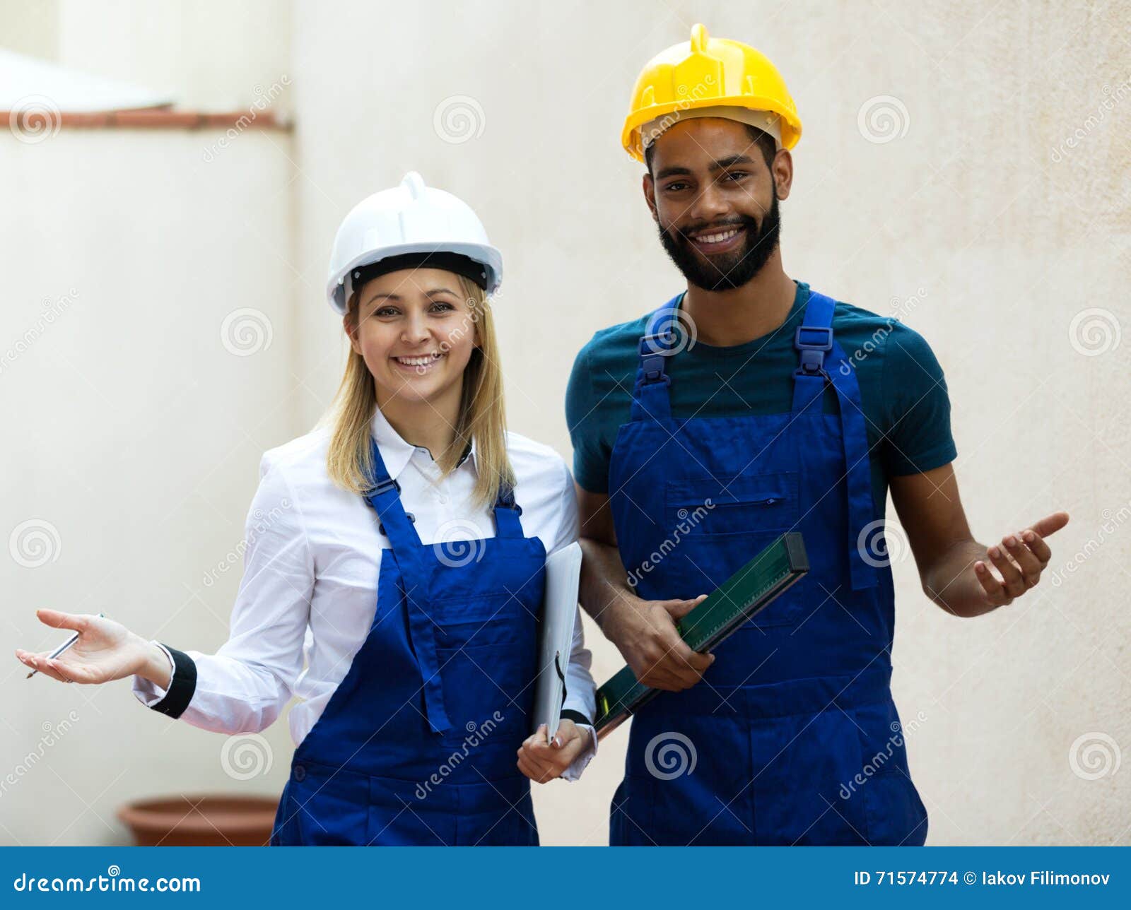 Smiling Technicians Smoothing the Wall Stock Photo - Image of check ...