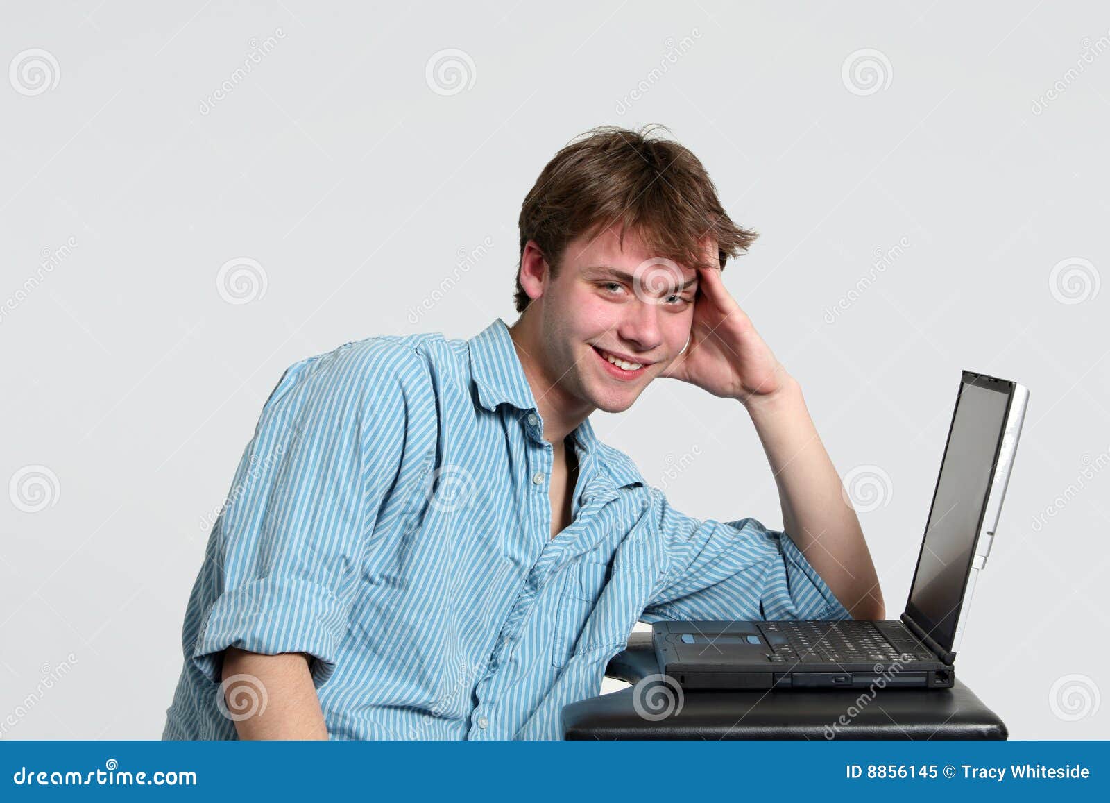Smiling Teen Boy at Computer Stock Image - Image of shot, people: 8856145