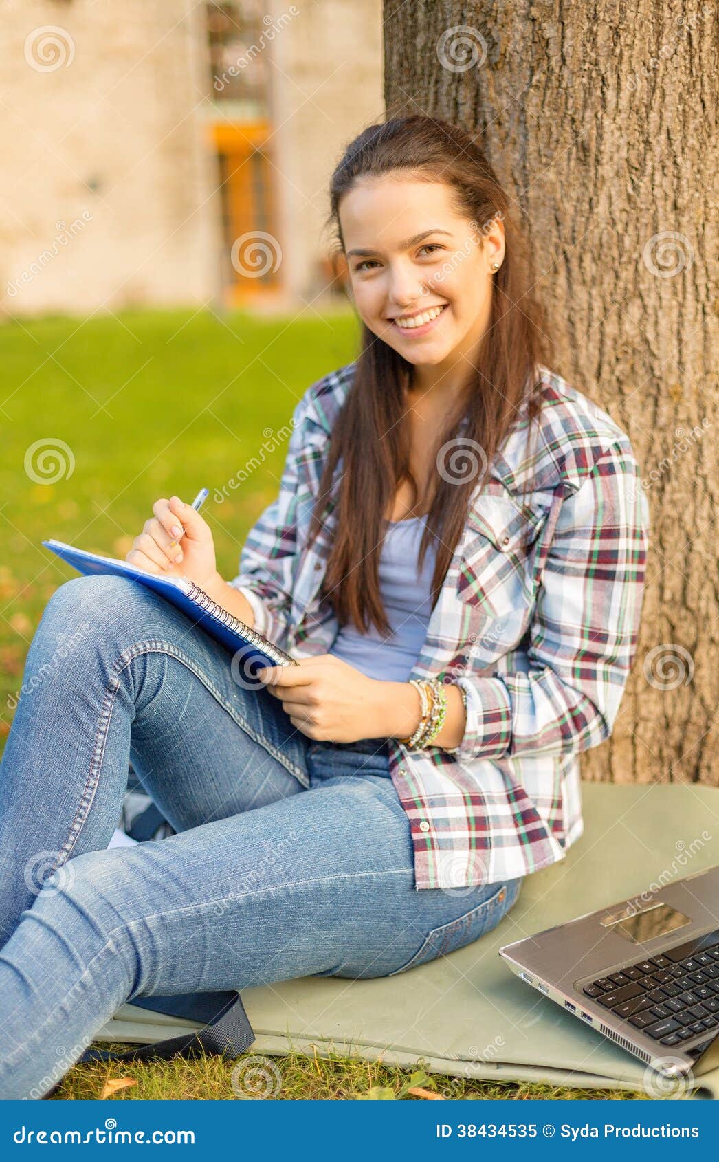 Smiling Teenager Writing in Notebook Stock Image - Image of exam ...