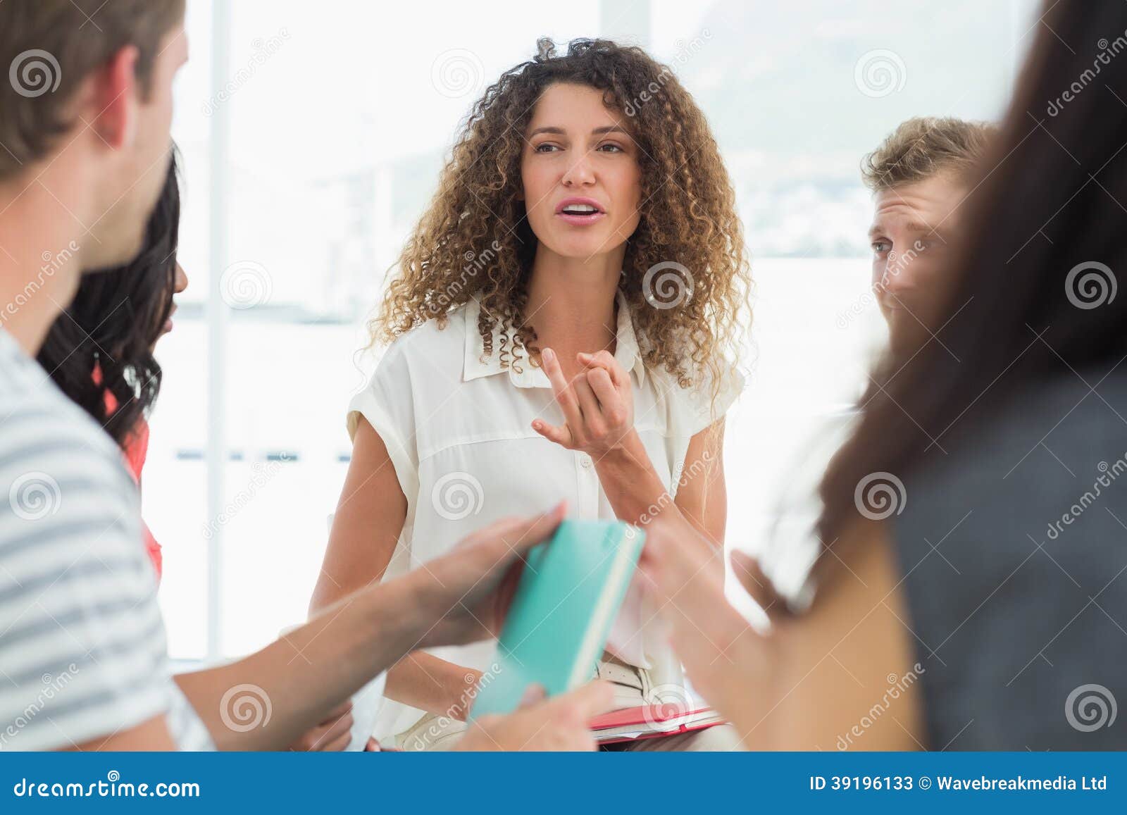 Smiling Therapist Talking with a Rehab Group Stock Image - Image of ...