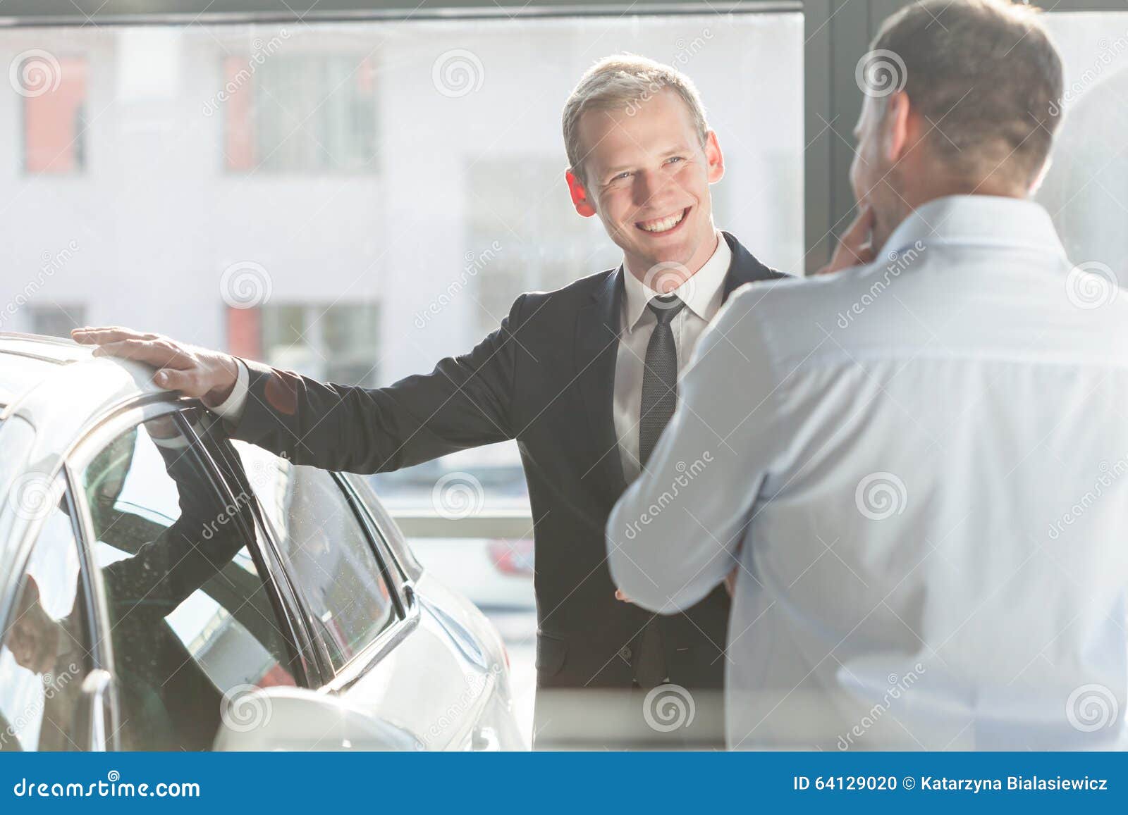 Smiling to a client stock photo. Image of gesturing, customer - 64129020