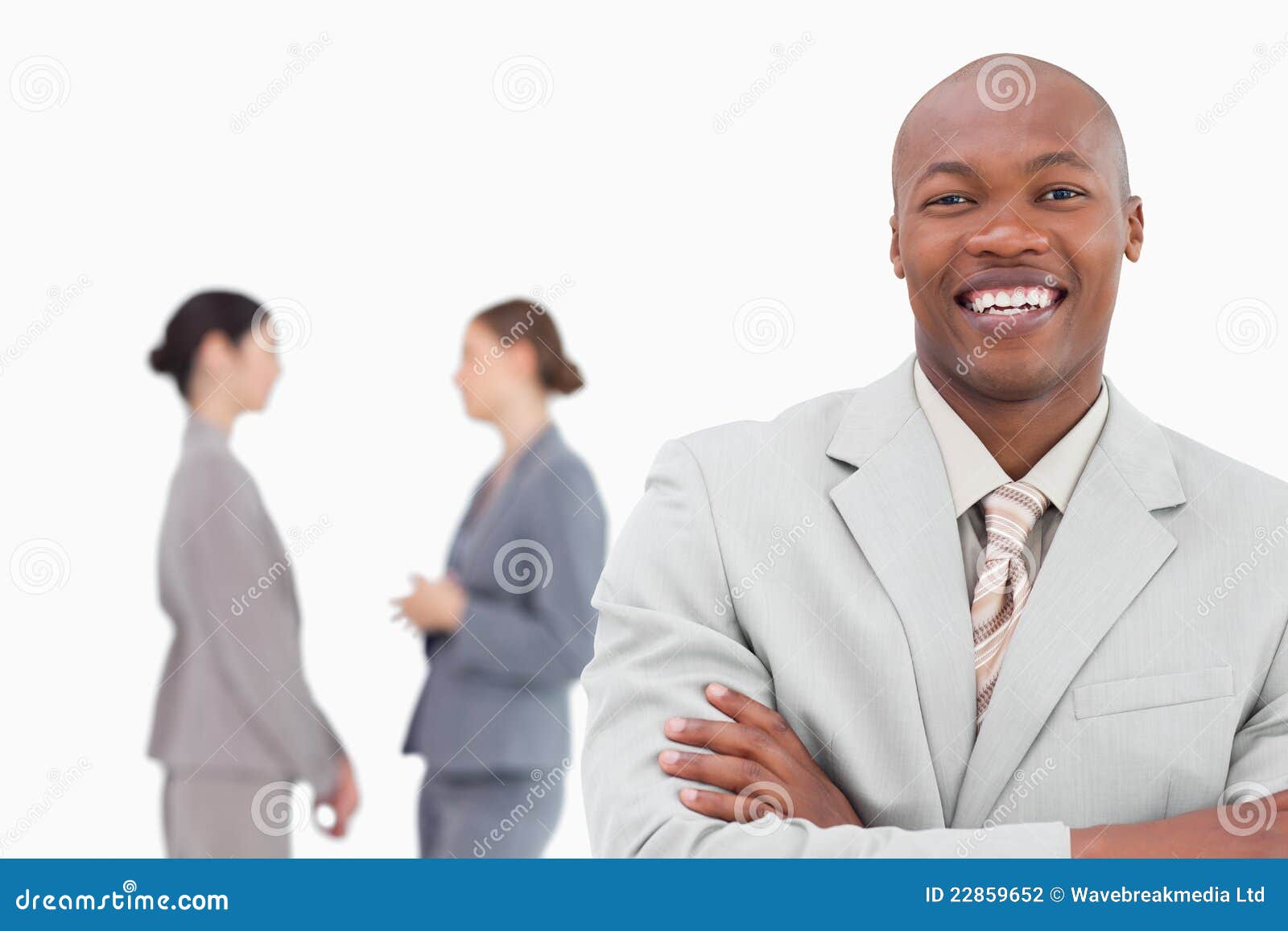 Smiling Tradesman with Colleagues Behind Him Stock Photo - Image of ...