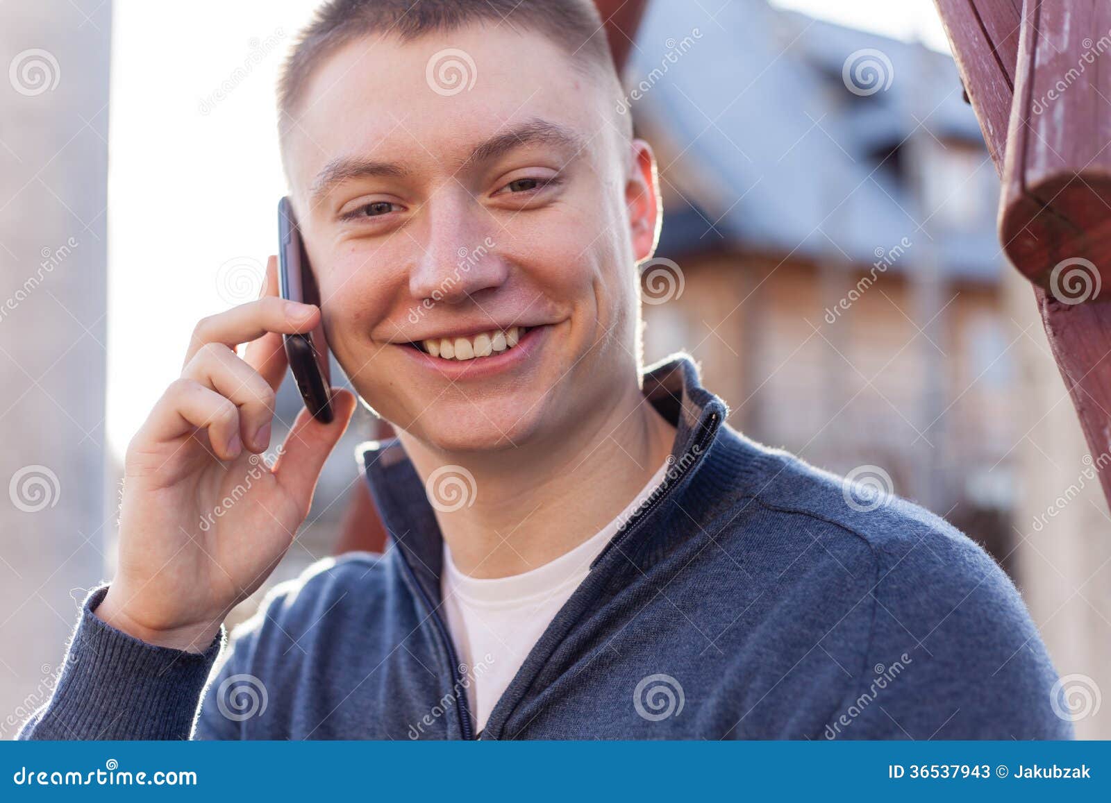Smiling Trendy Guy Talking on the Phone Outdoor. Stock Image - Image of ...