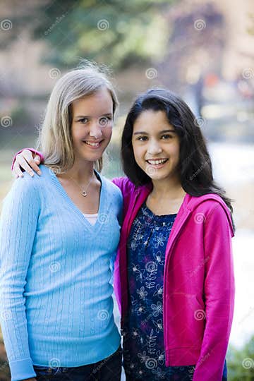 Smiling Tween Girls Outdoors Stock Photo - Image of togetherness ...
