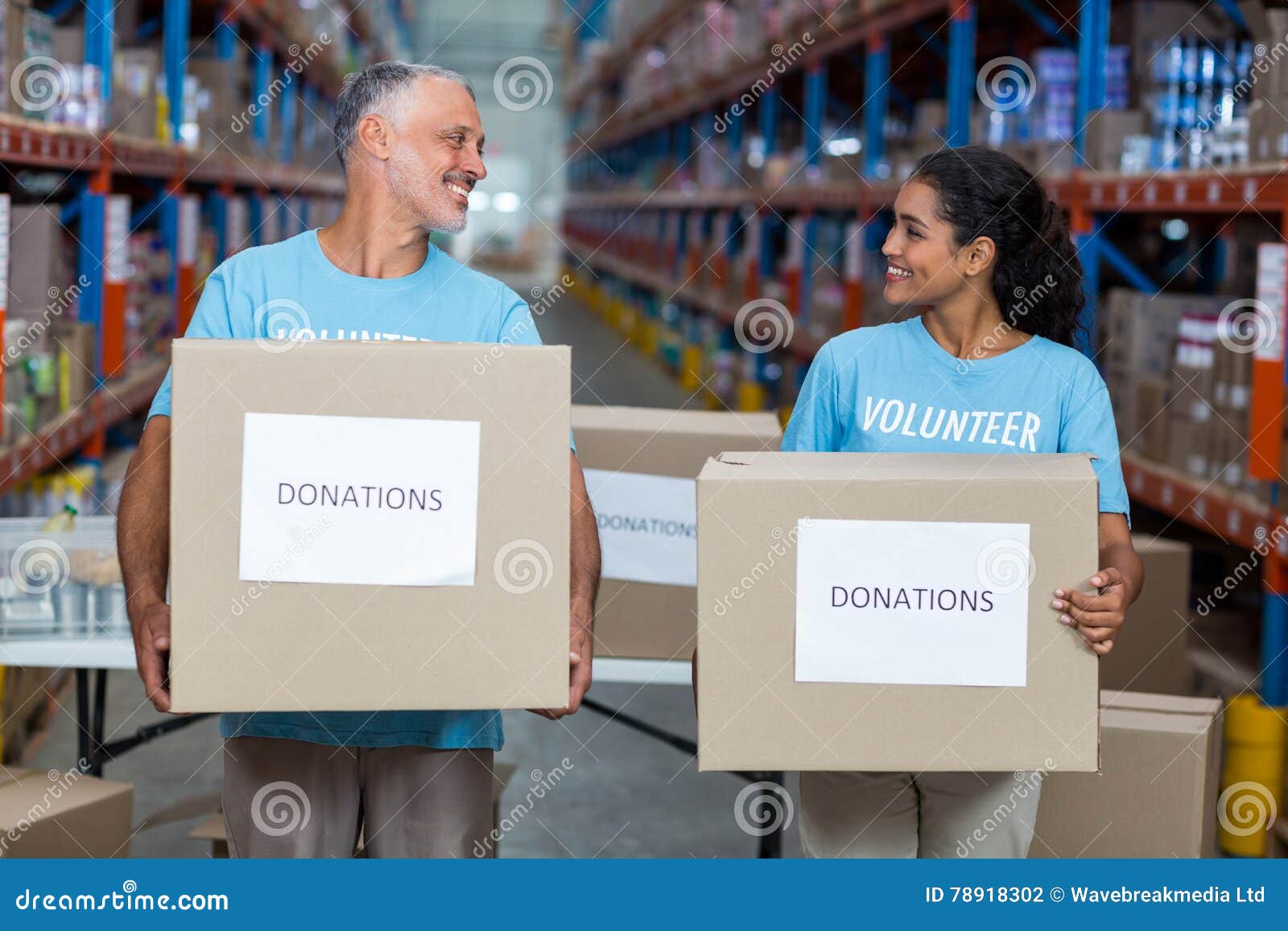 Smiling Two Volunteers Holding a Donations Box Stock Photo - Image of ...