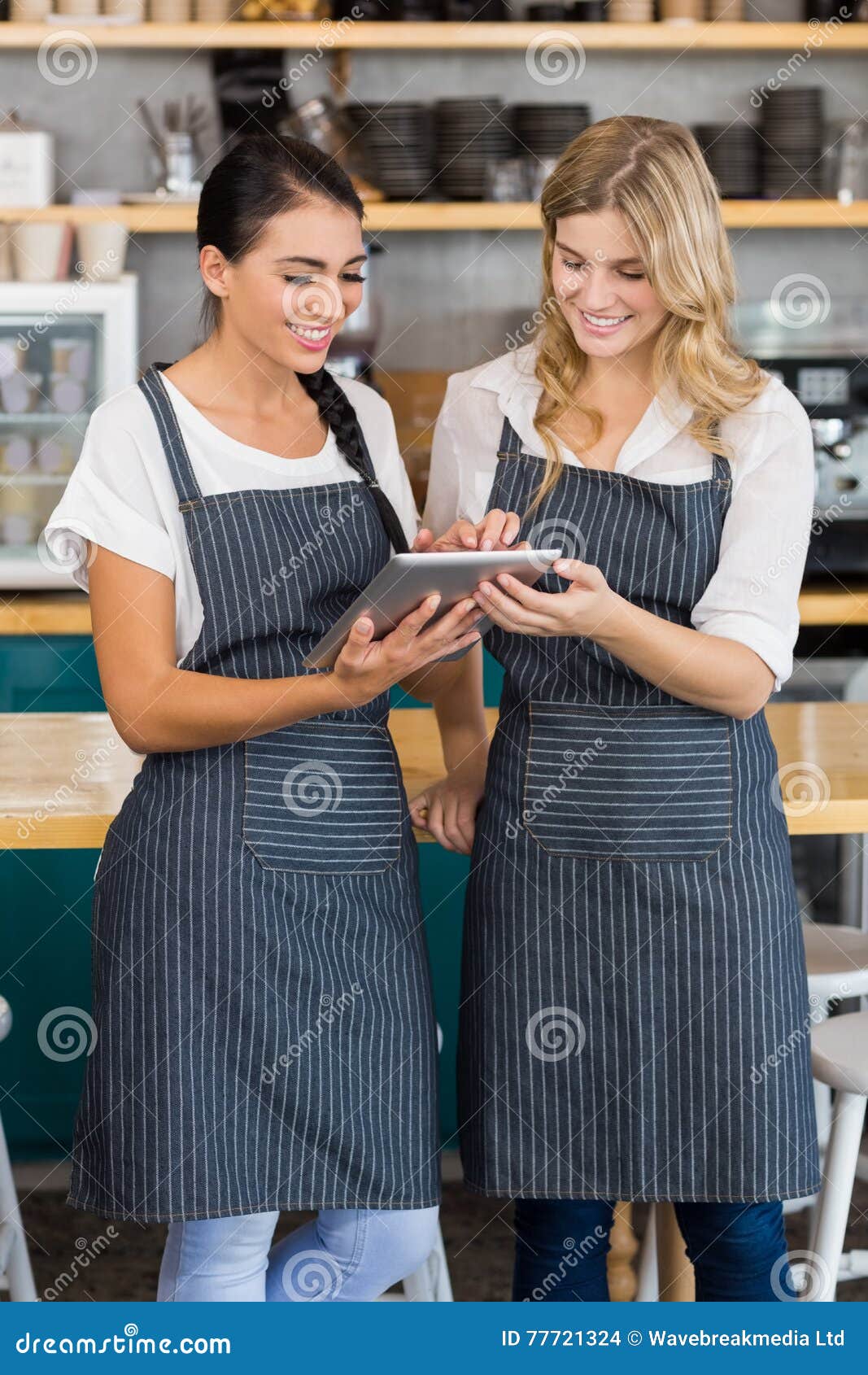 Smiling Two Waitresses Using Digital Tablet Stock Photo - Image of ...
