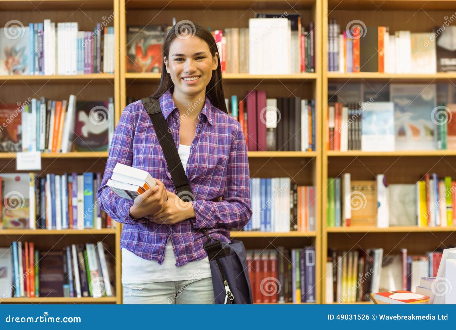 Smiling University Student Holding Textbook Stock Photo - Image of ...