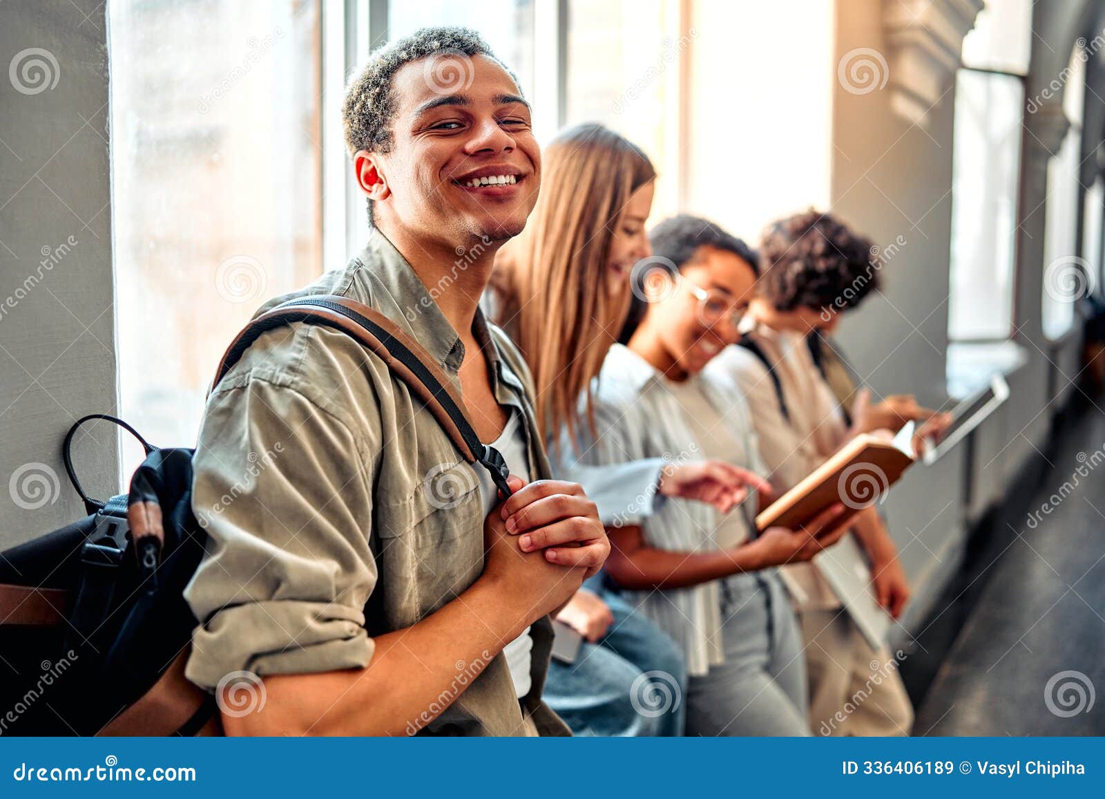 A Smiling University Student Stock Image - Image of backpack, college ...