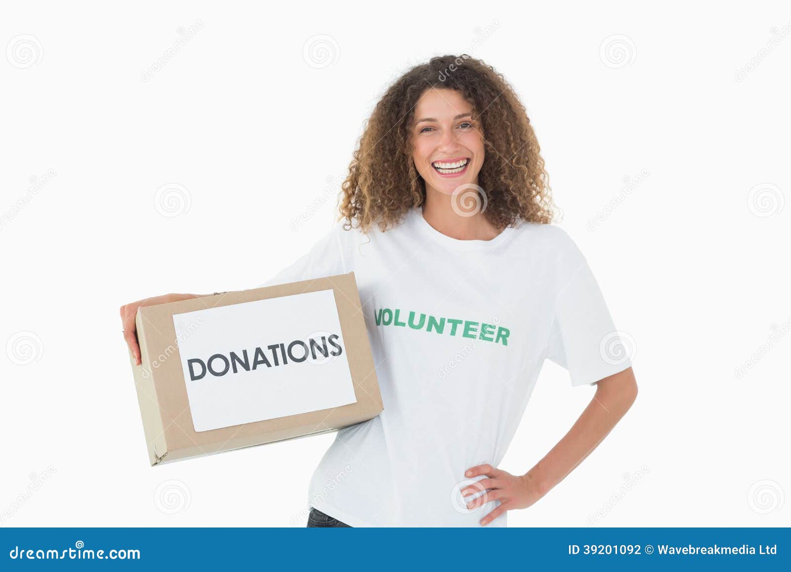Smiling Volunteer Holding a Box of Donations with Hand on Hip Stock ...