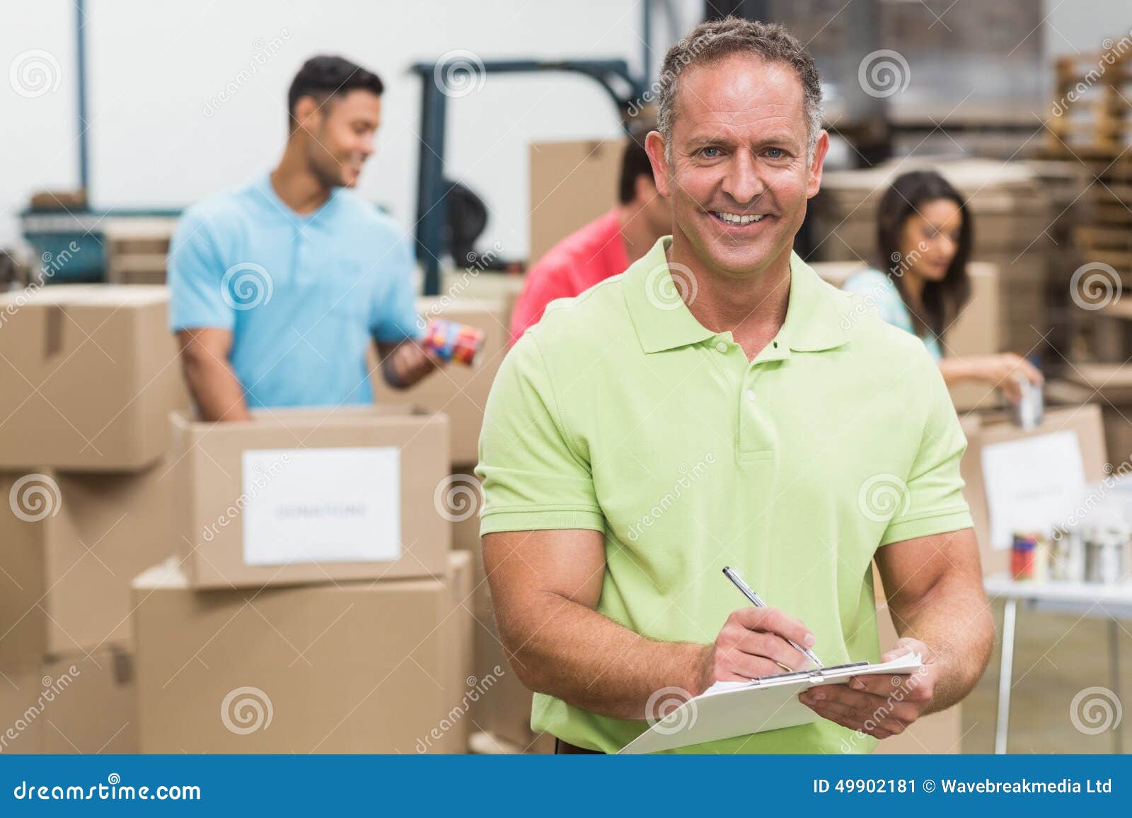Smiling Volunteer Man Taking Notes Holding Clipboard Stock Image ...