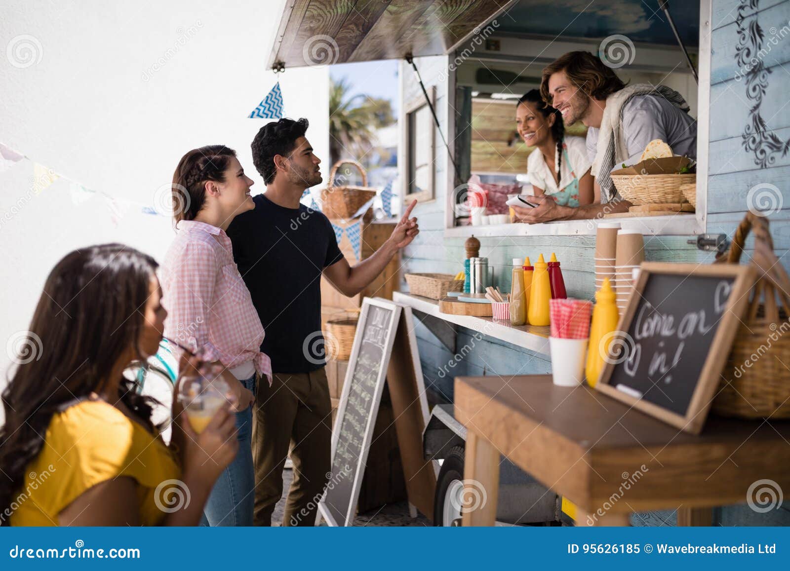 Smiling Waiter Taking Order from Couple Stock Image - Image of happy ...